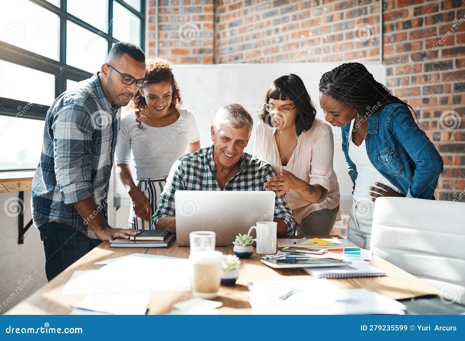 Diversity, Group of Colleagues and Using a Laptop Together or ...
