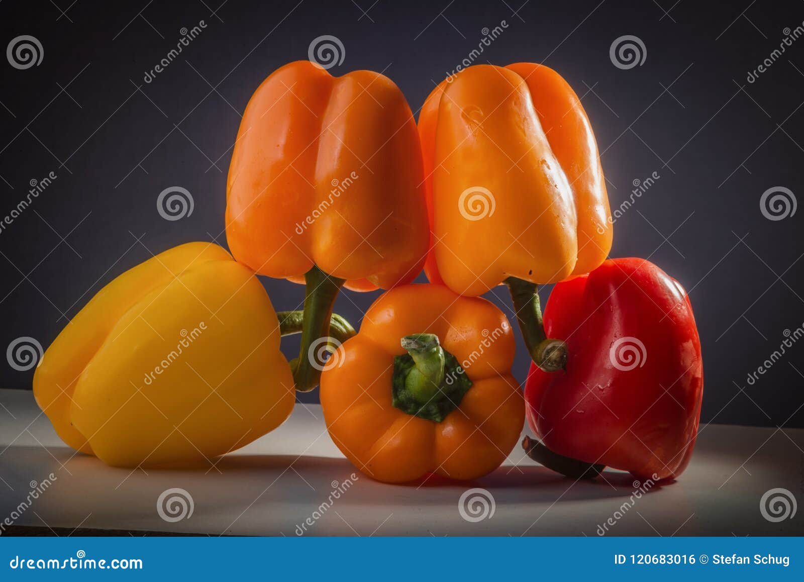 Colorful Peppers on Dark - Orange in the Middle Stock Photo - Image of ...