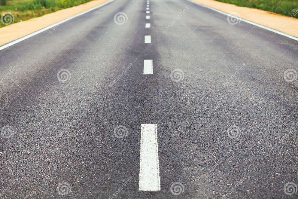 Dividing line on the road stock photo. Image of macro - 57260582
