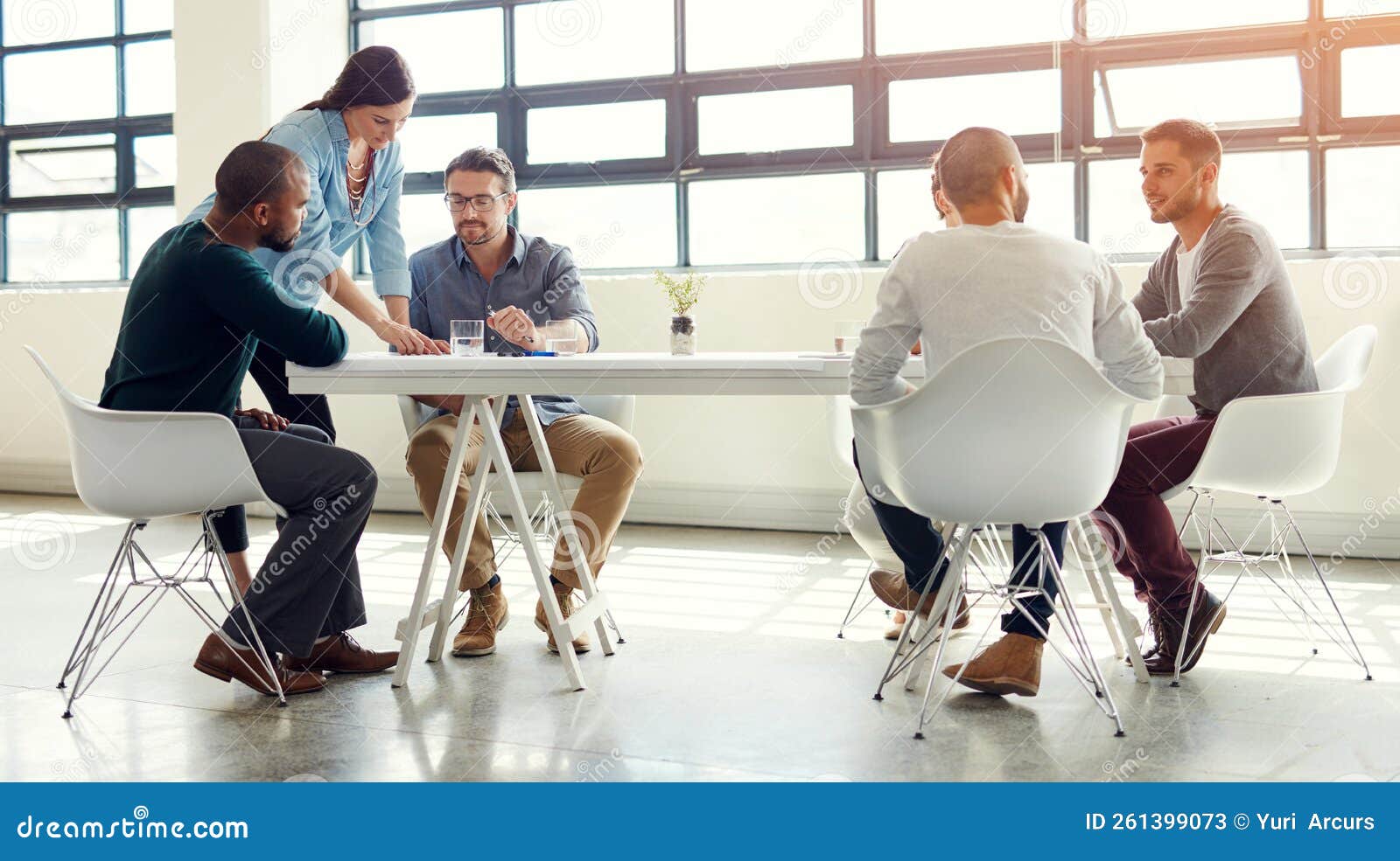 Dividing Up Task for Efficiency. a Group of Coworkers Having a Meeting ...