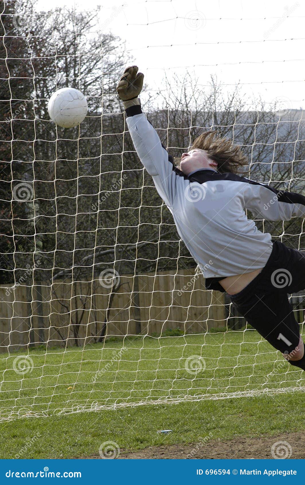 A Diving Goalkeeper Missing a Save !! Stock Photo - Image of loser ... A Diving Goalkeeper Missing a Save !! Stock Photo - Image of loser ...