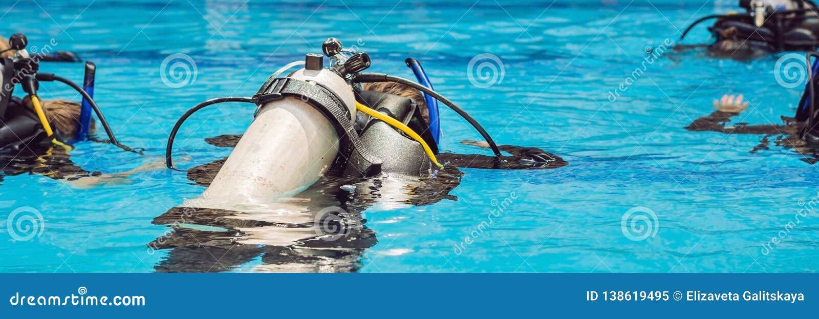Diving Instructor and Students. Instructor Teaches Students To Dive ...