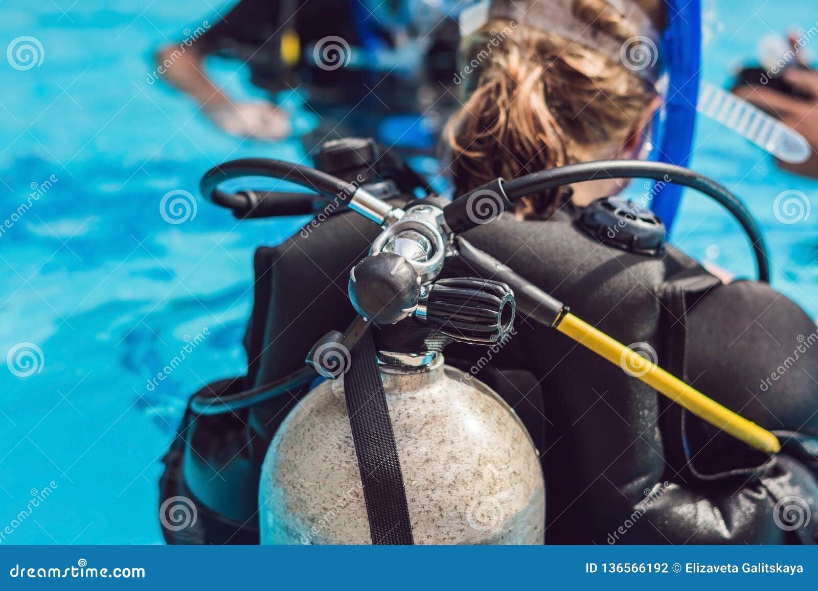 Diving Instructor and Students. Instructor Teaches Students To Dive ...