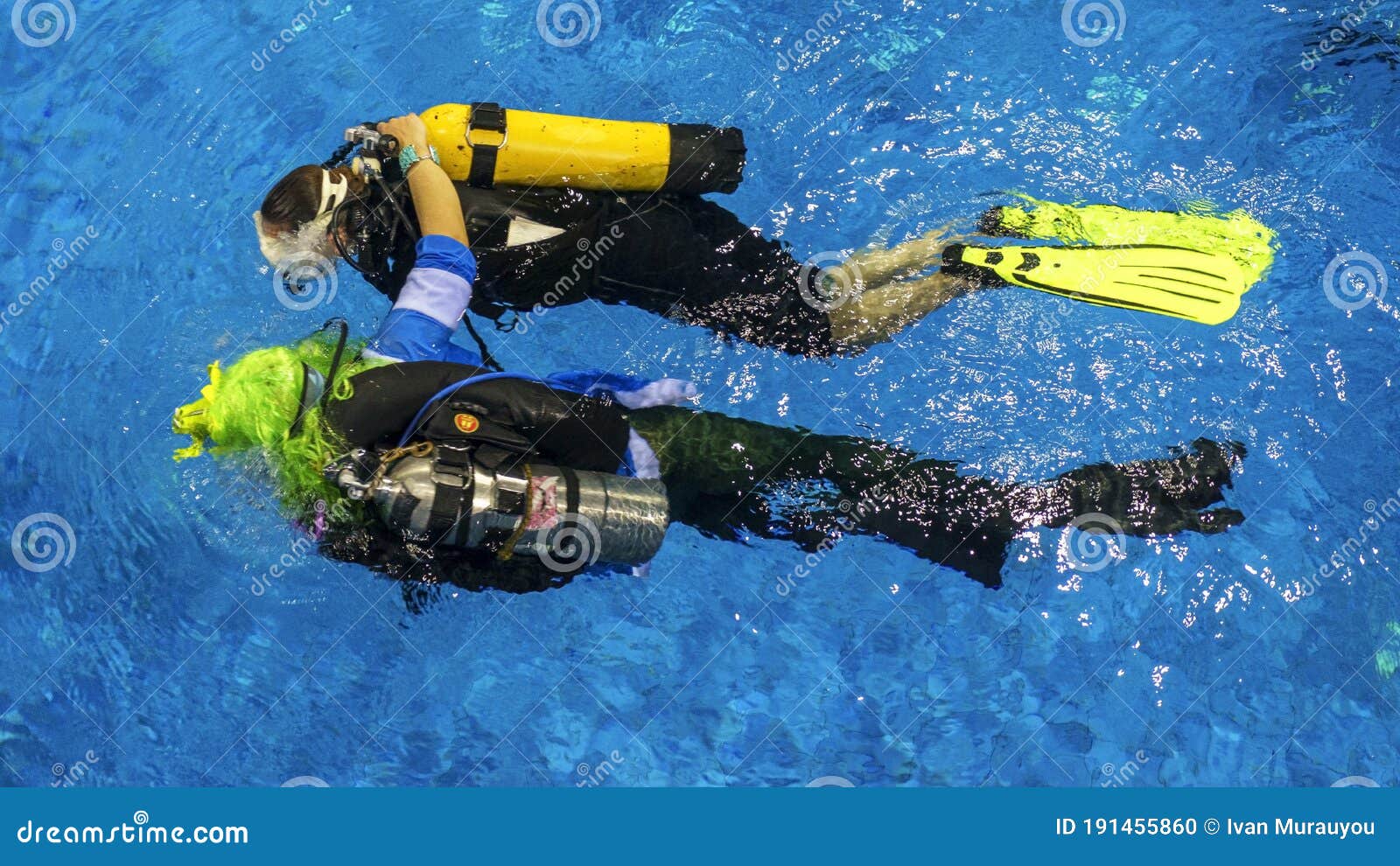 Diving Instructor and Students. Instructor Teaches Students To Dive in ...