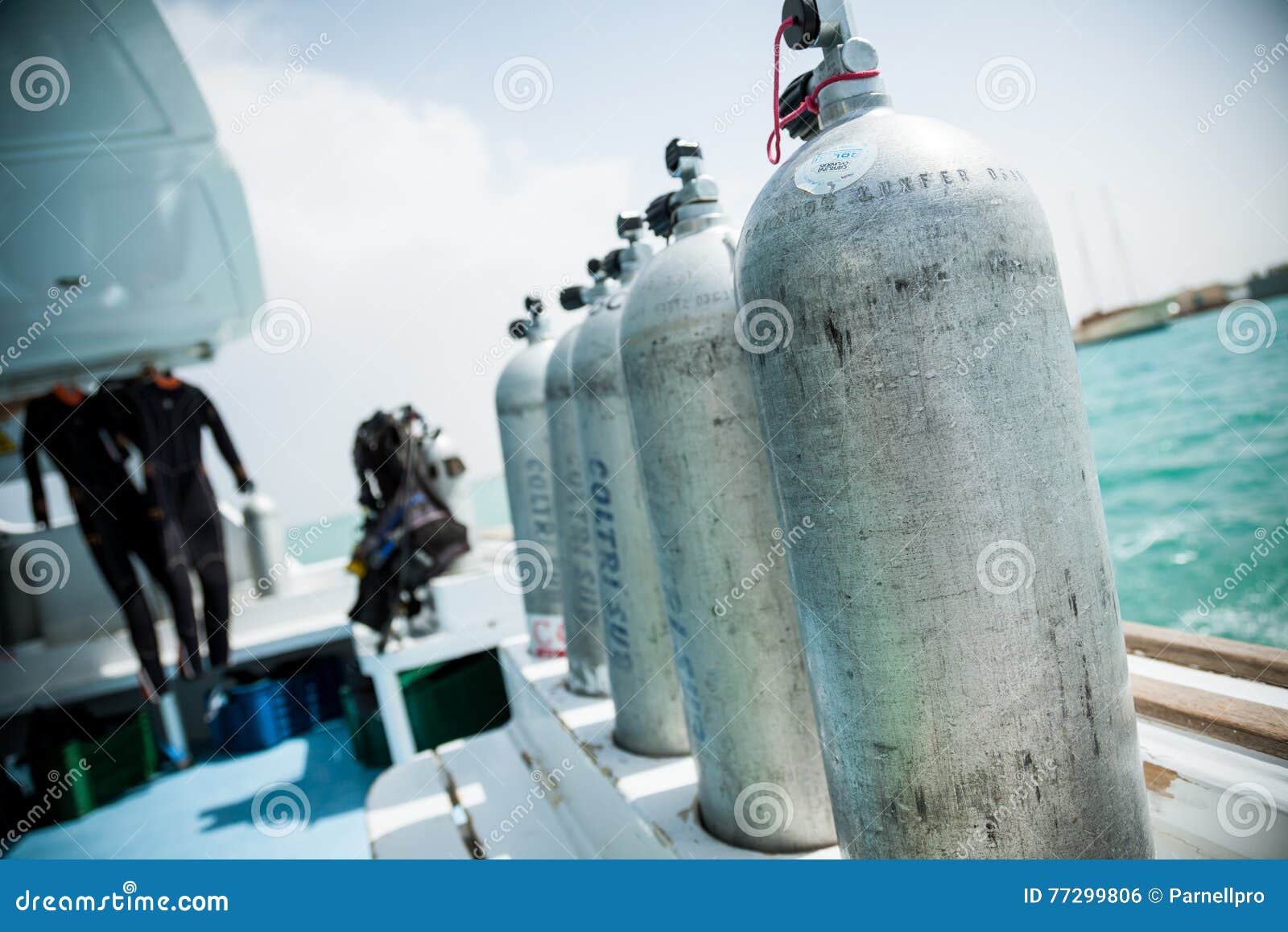 Diving stock photo. Image of dive, airtanks, blue, wetsuits - 77299806