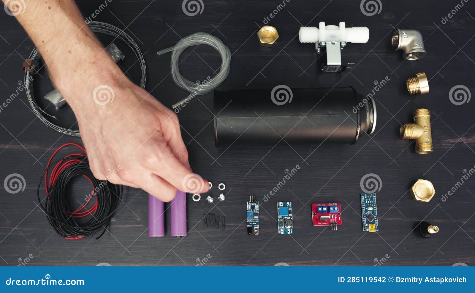 DIY Creations: Young Man Showcasing Top-View Maker Materials and ...