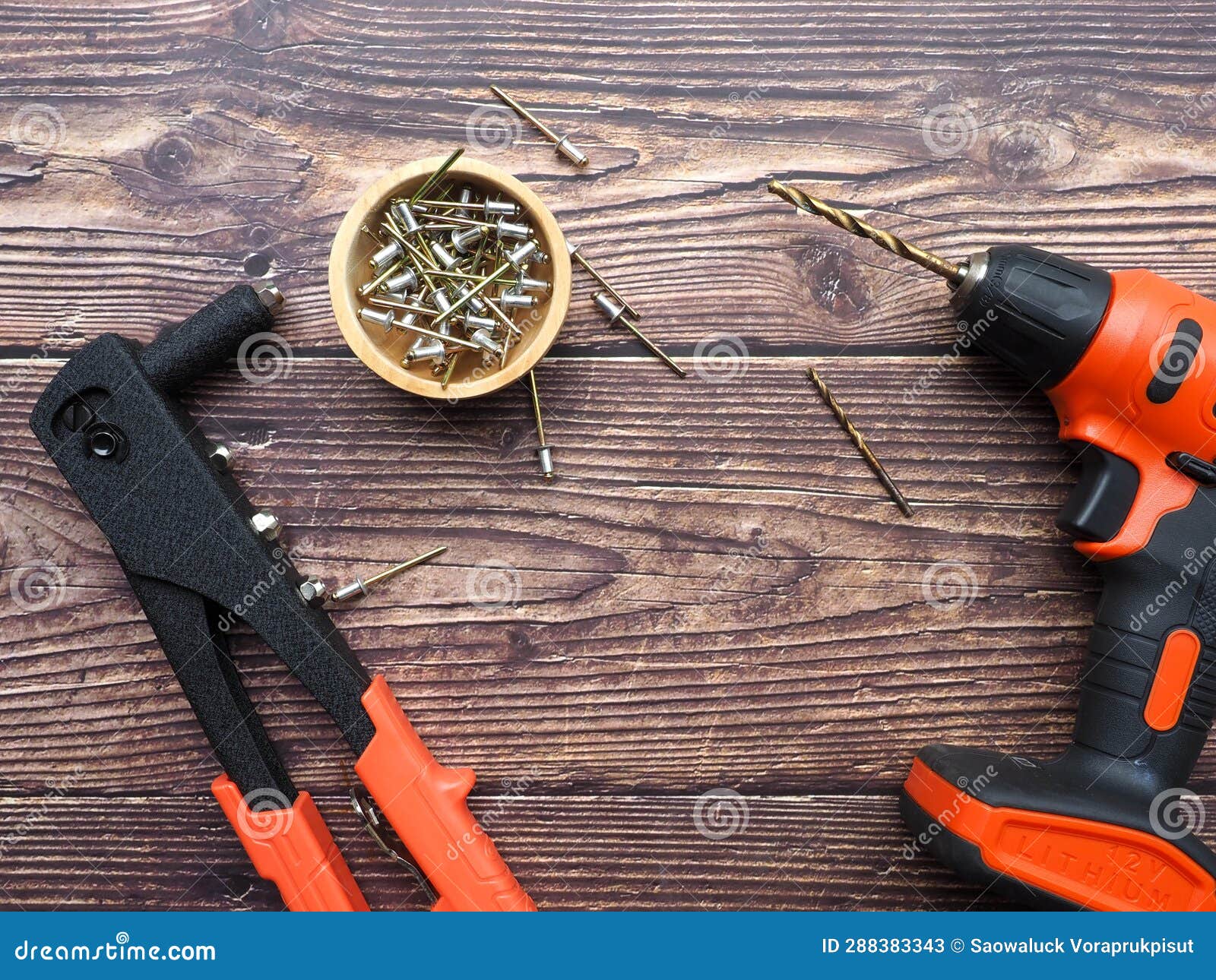 Hand Riveting Tool with Orange Handle and Cordless Drill with Blind ...