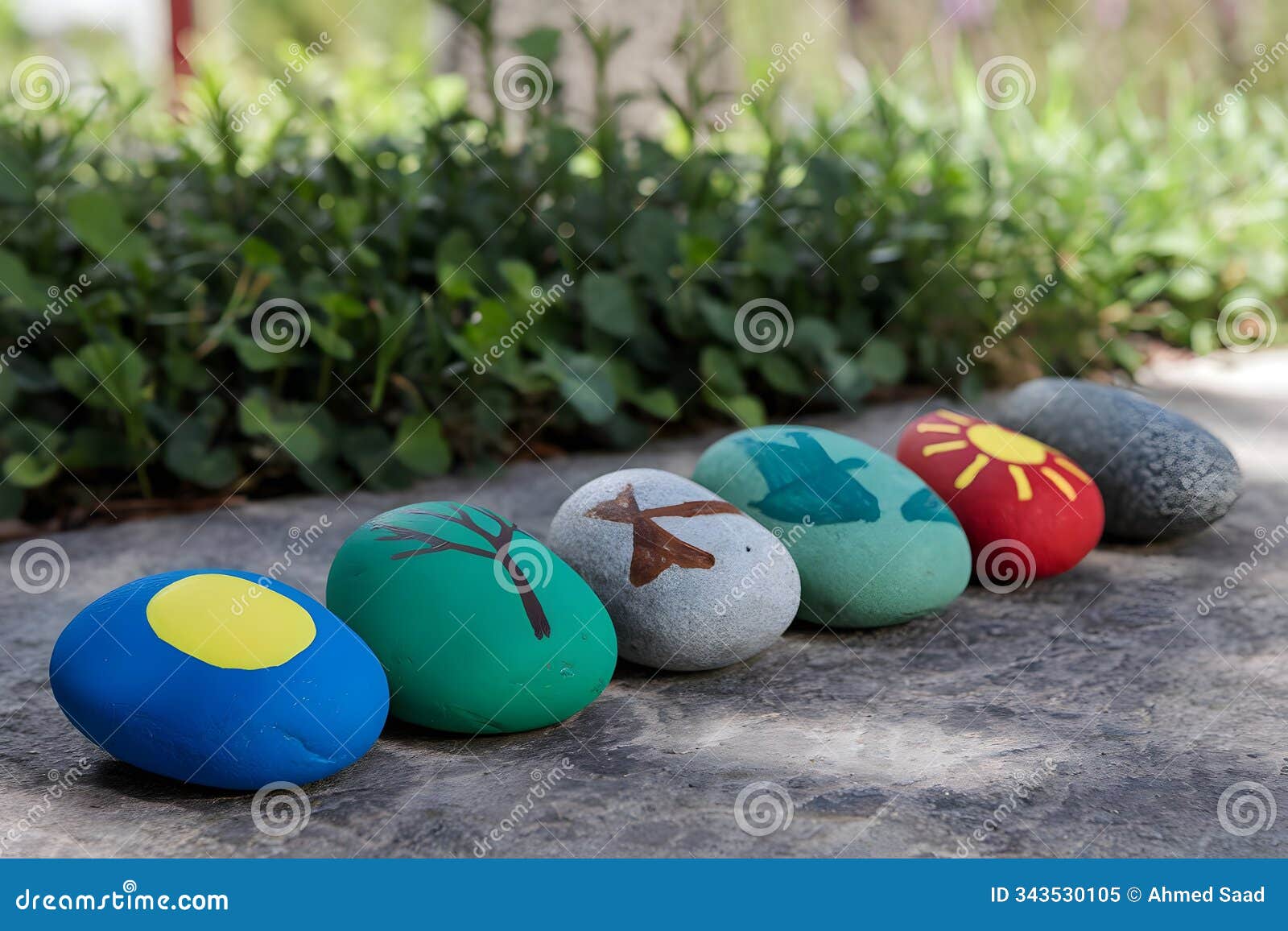 DIY Painted Pebbles with Soft Abstract Designs in Earthy Colors Stock ...