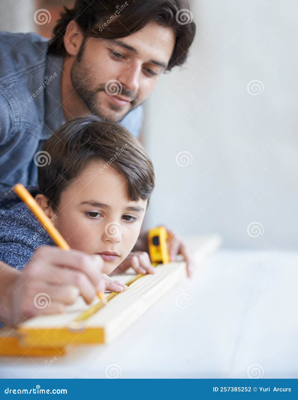 DIY is a Precise Business. a Father and Son Doing Woodwork Together ...