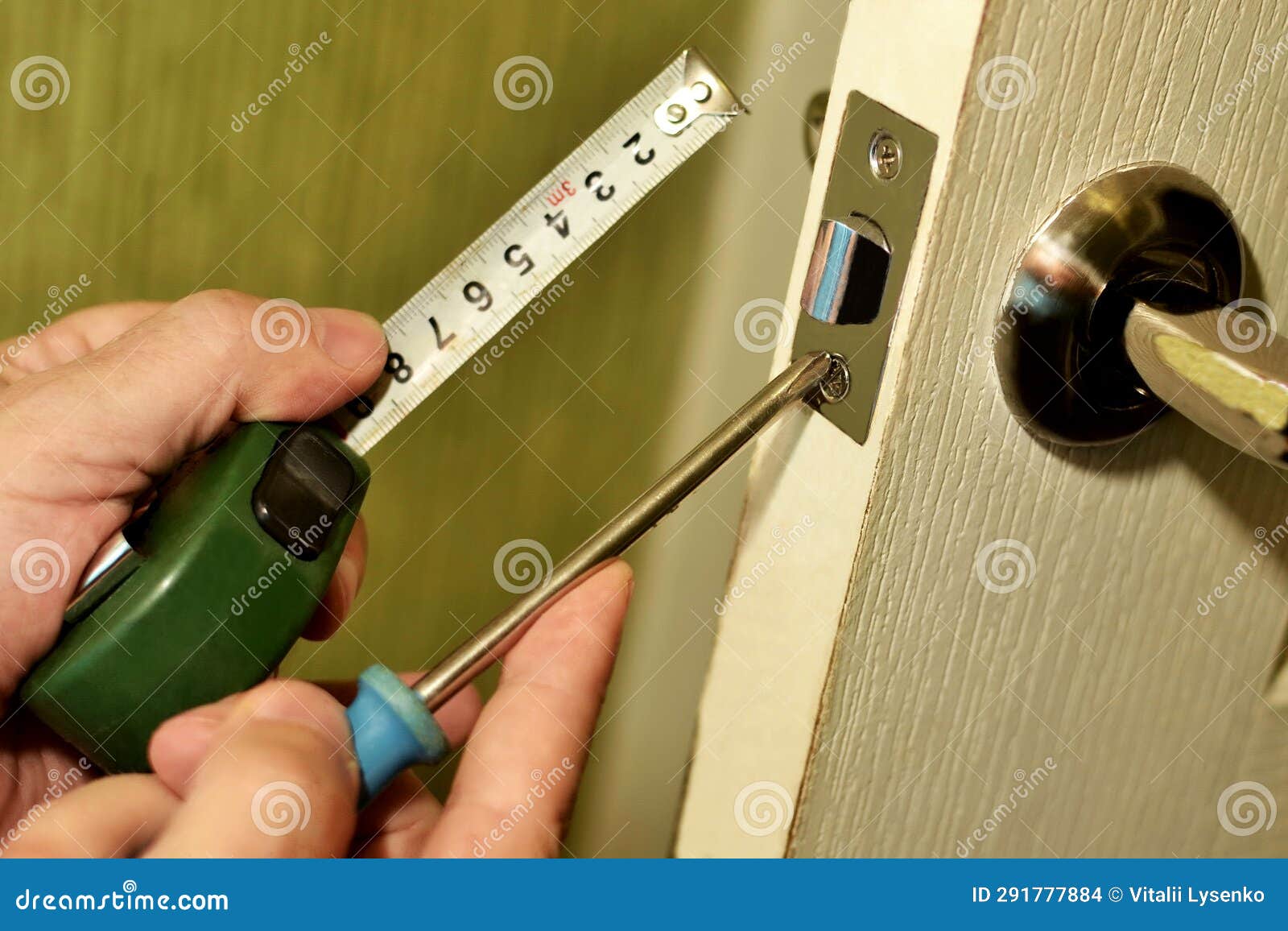 DIY Repair, Worker Installing Door Lock Using Hand Screwdriver Stock ...