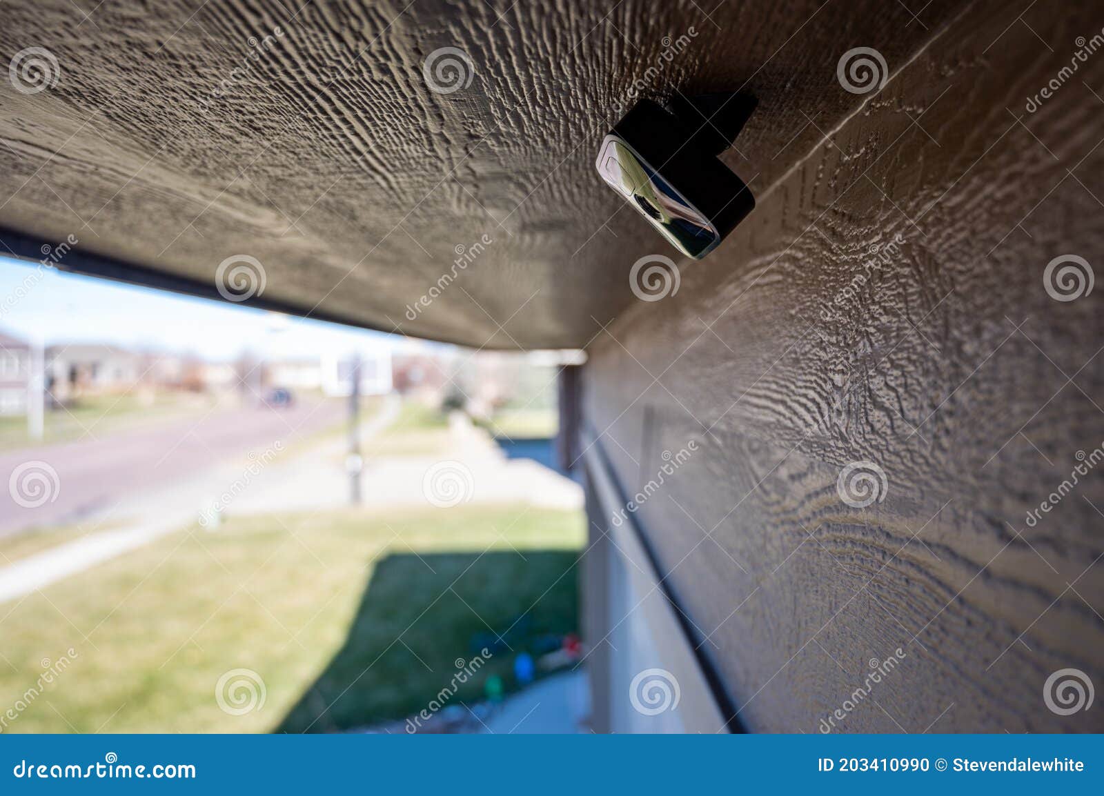 Selective Focus on an Outdoor Security Camera Mounted Under a Roof ...