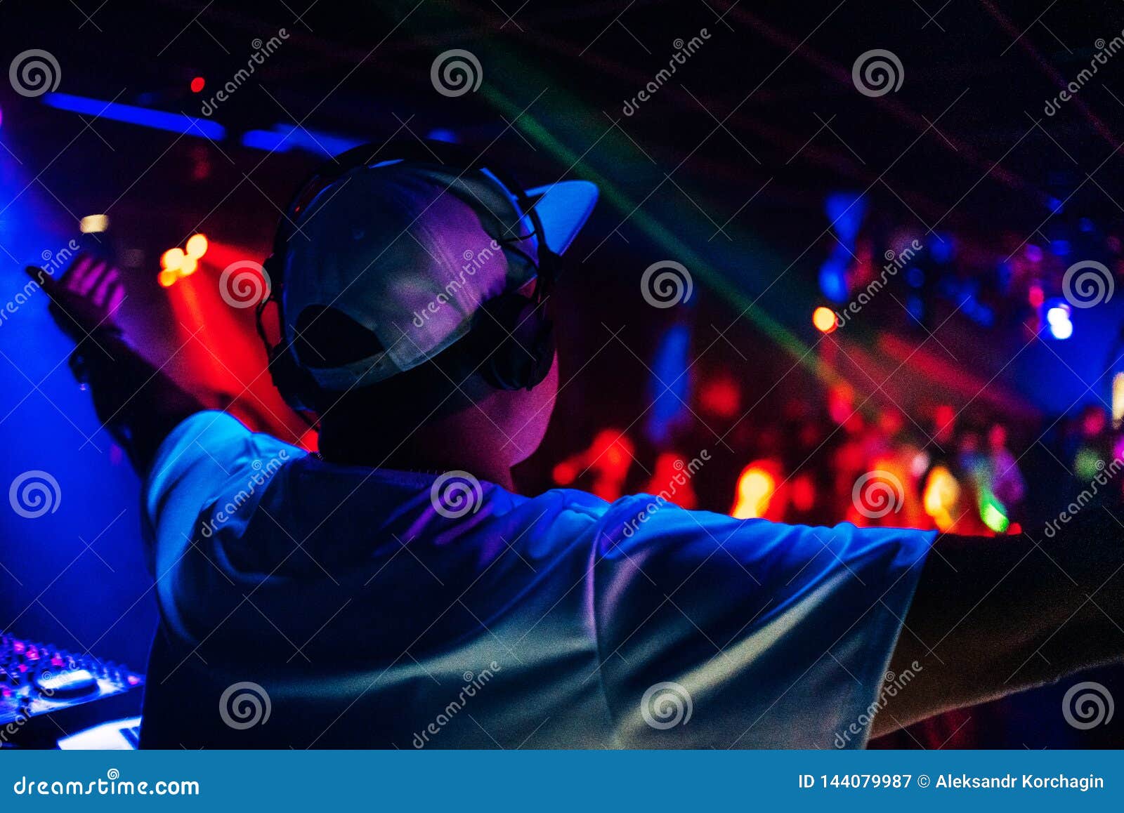 DJ from the Back on the Stage of a Nightclub with Headphones Stock ...