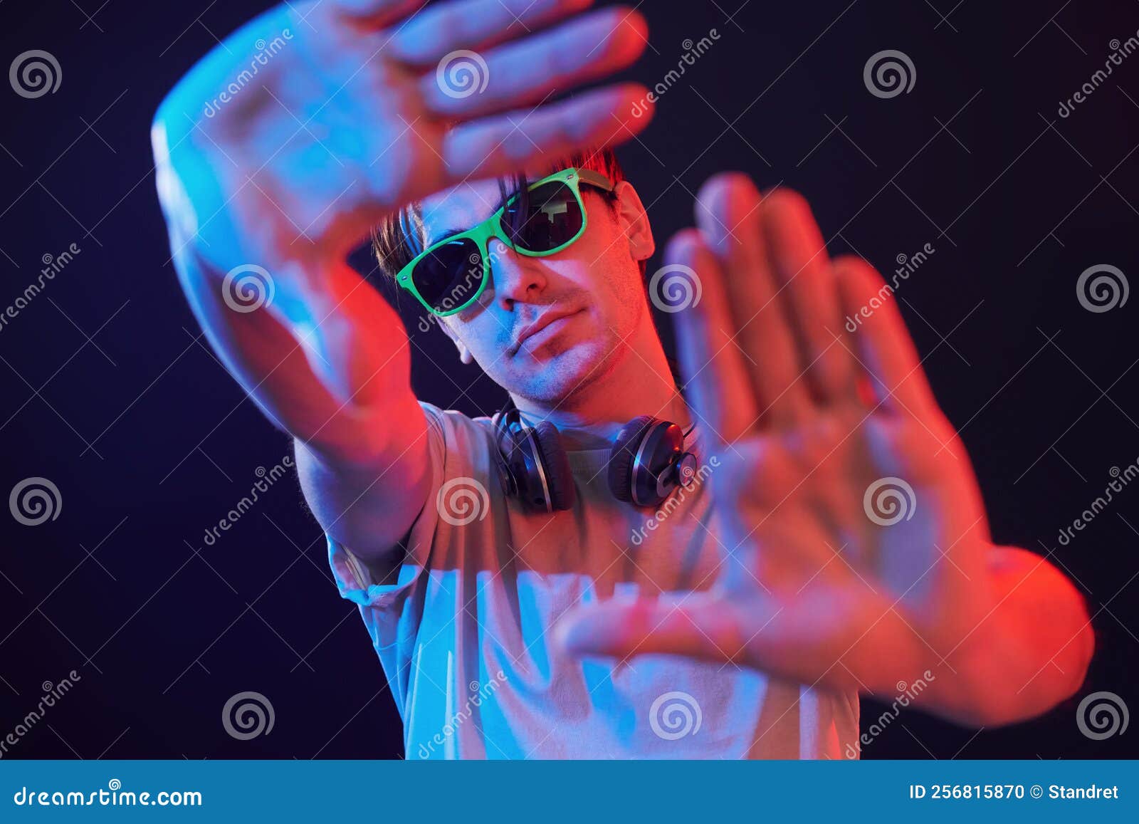 Dj is Having Fun. Man Standing in the Studio with Neon Light Stock ...