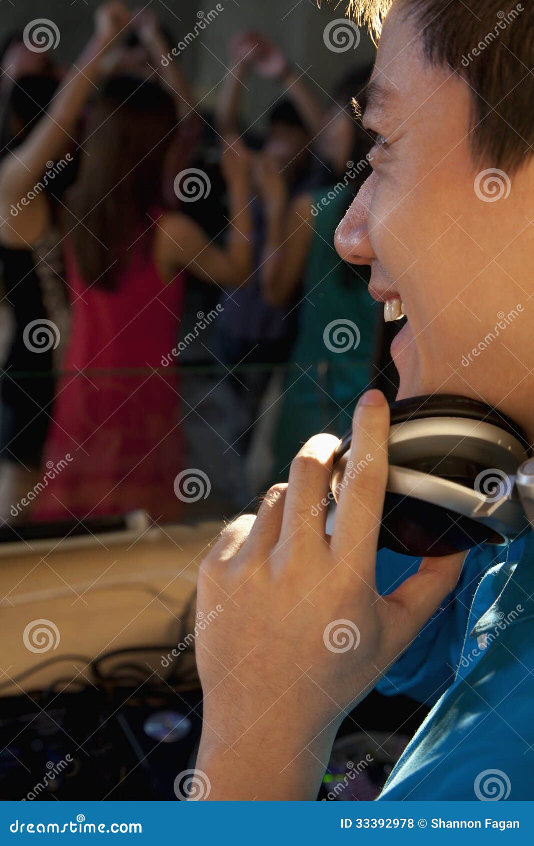 DJ Laughing and Watching the Dancing Crowd in Nightclub Stock Photo ...