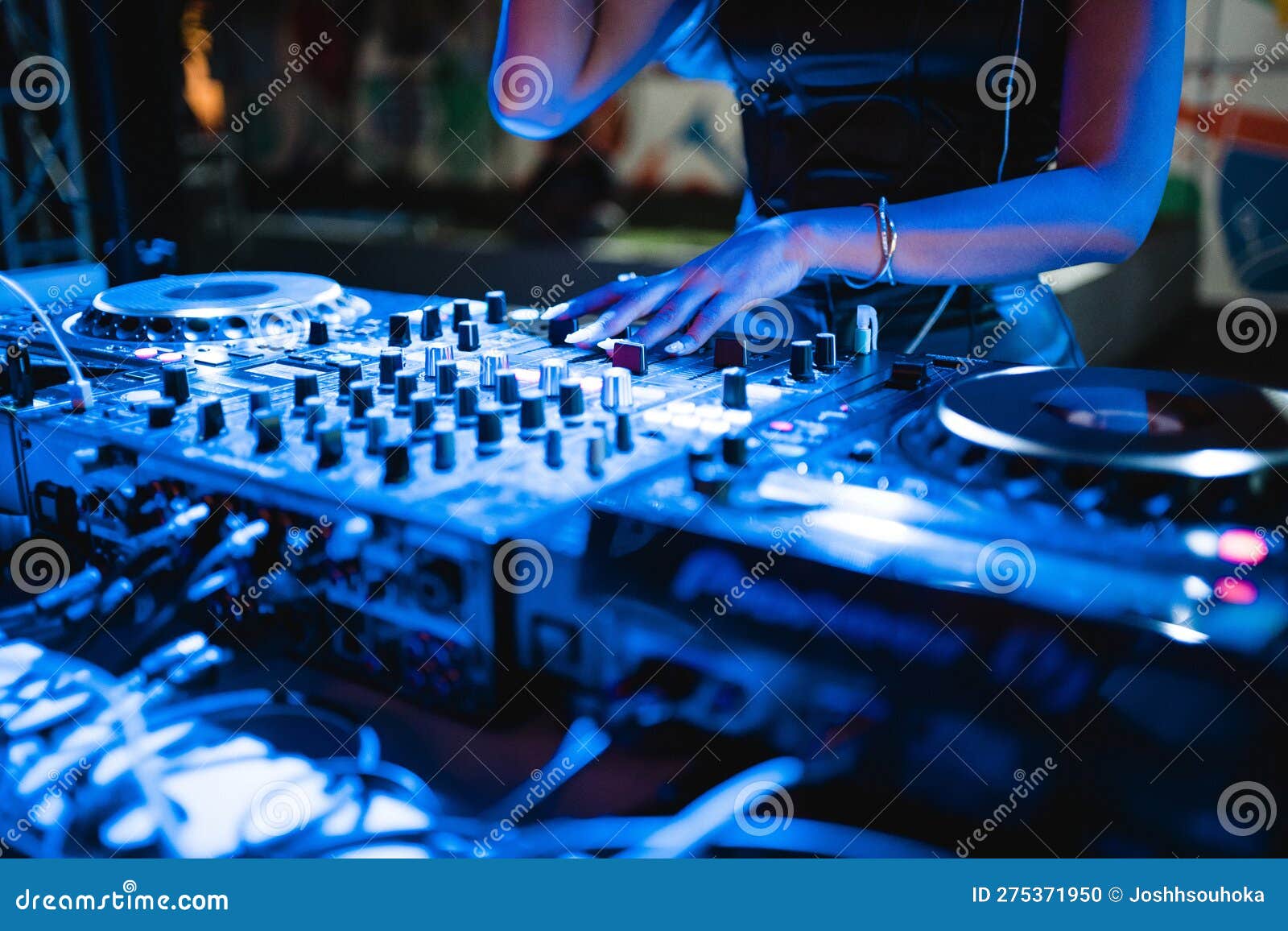 A Dj is Playing His Dj Instrument at an Event Stock Photo - Image of ...