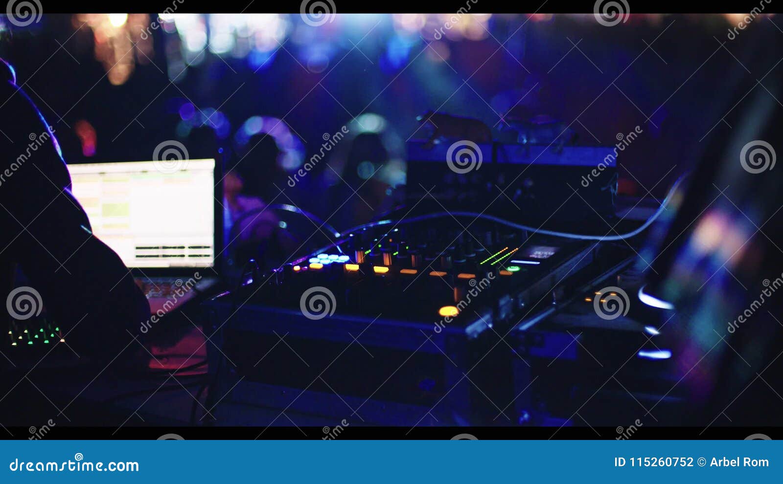 DJ Playing in a Large Trance Party with Large Crowd of People Dancing ...