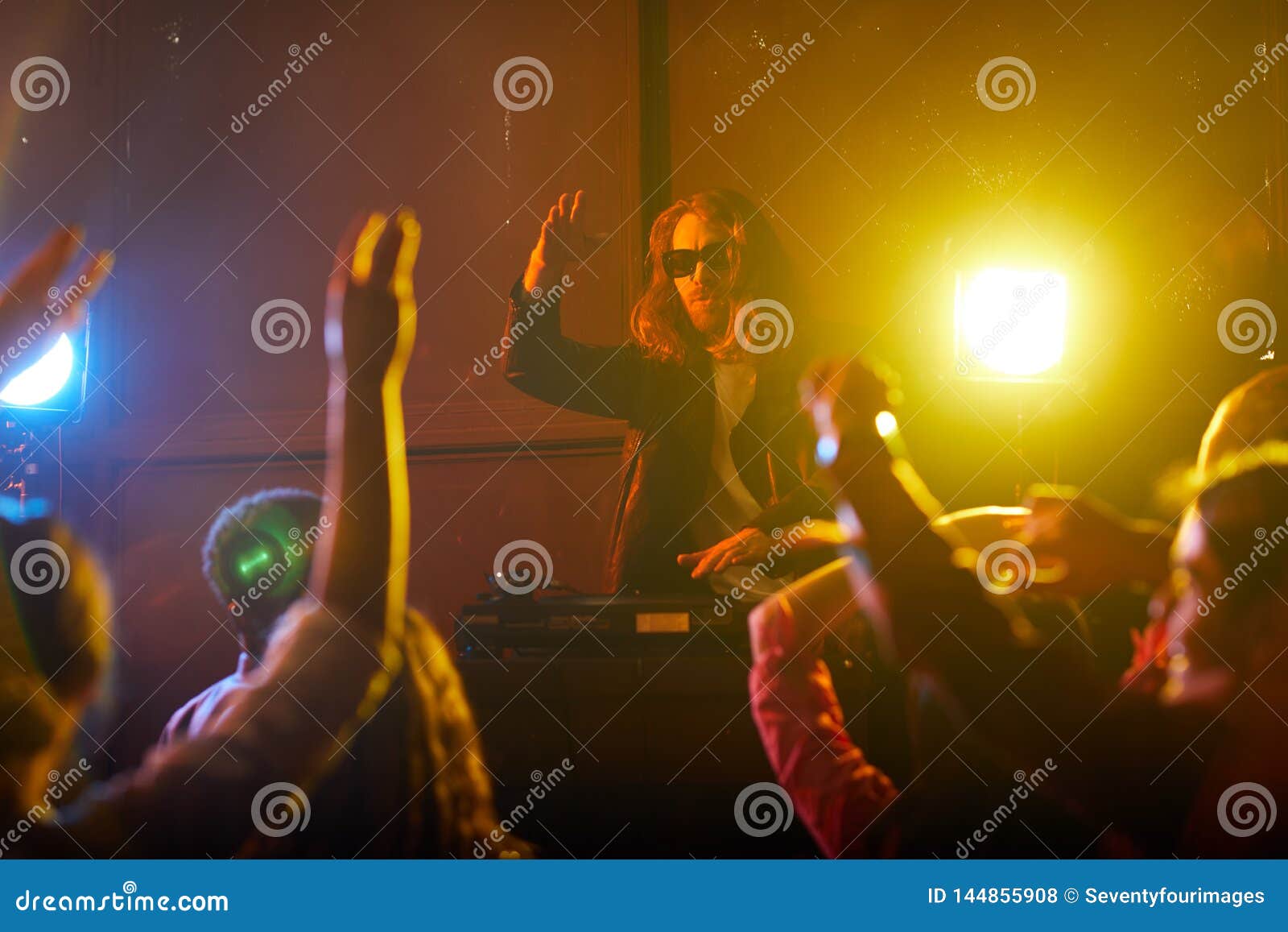 DJ rocking crowd stock photo. Image of clubber, group - 144855908