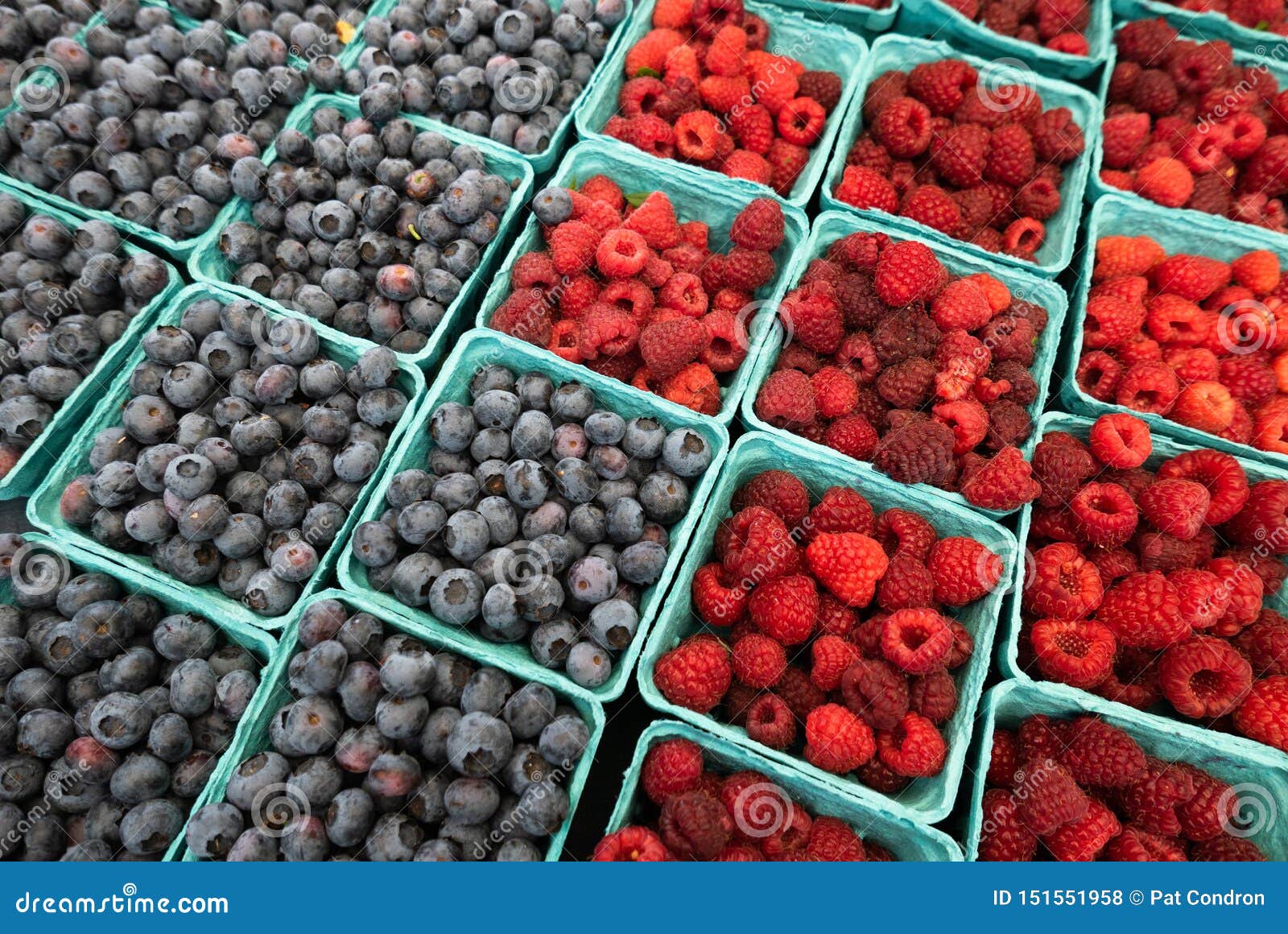 Diagonal Rows of Green Cartons with Fresh Raspberries and Blueberries ...