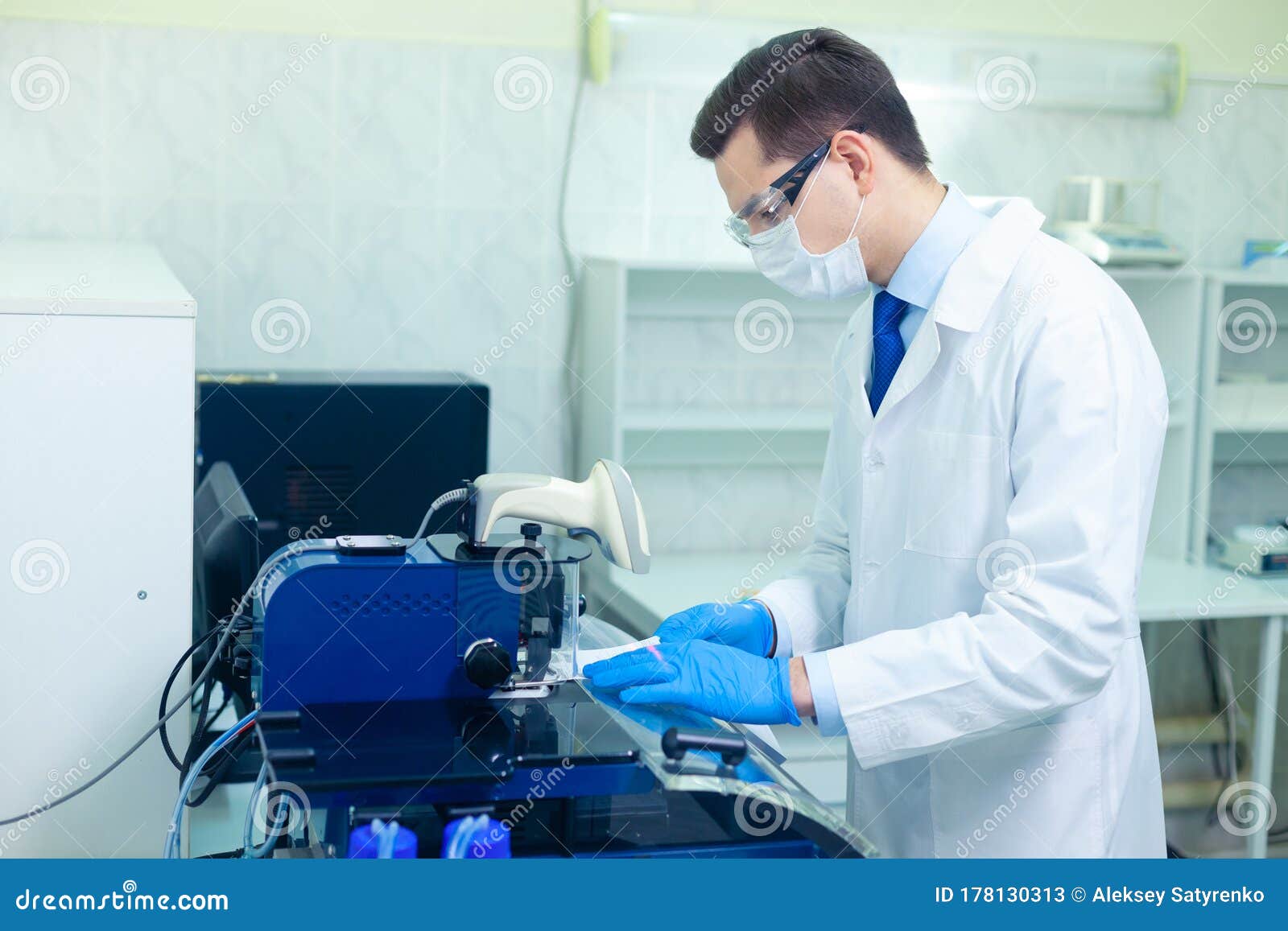 DNA Laboratory. the Expert Puts the Human DNA into the Database Using ...