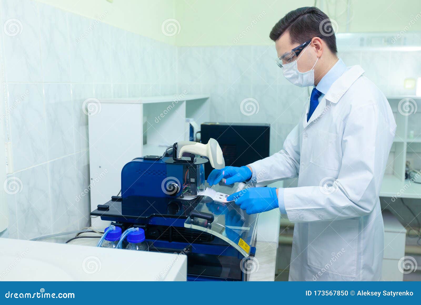 DNA Laboratory. the Expert Puts the Human DNA into the Database Using ...