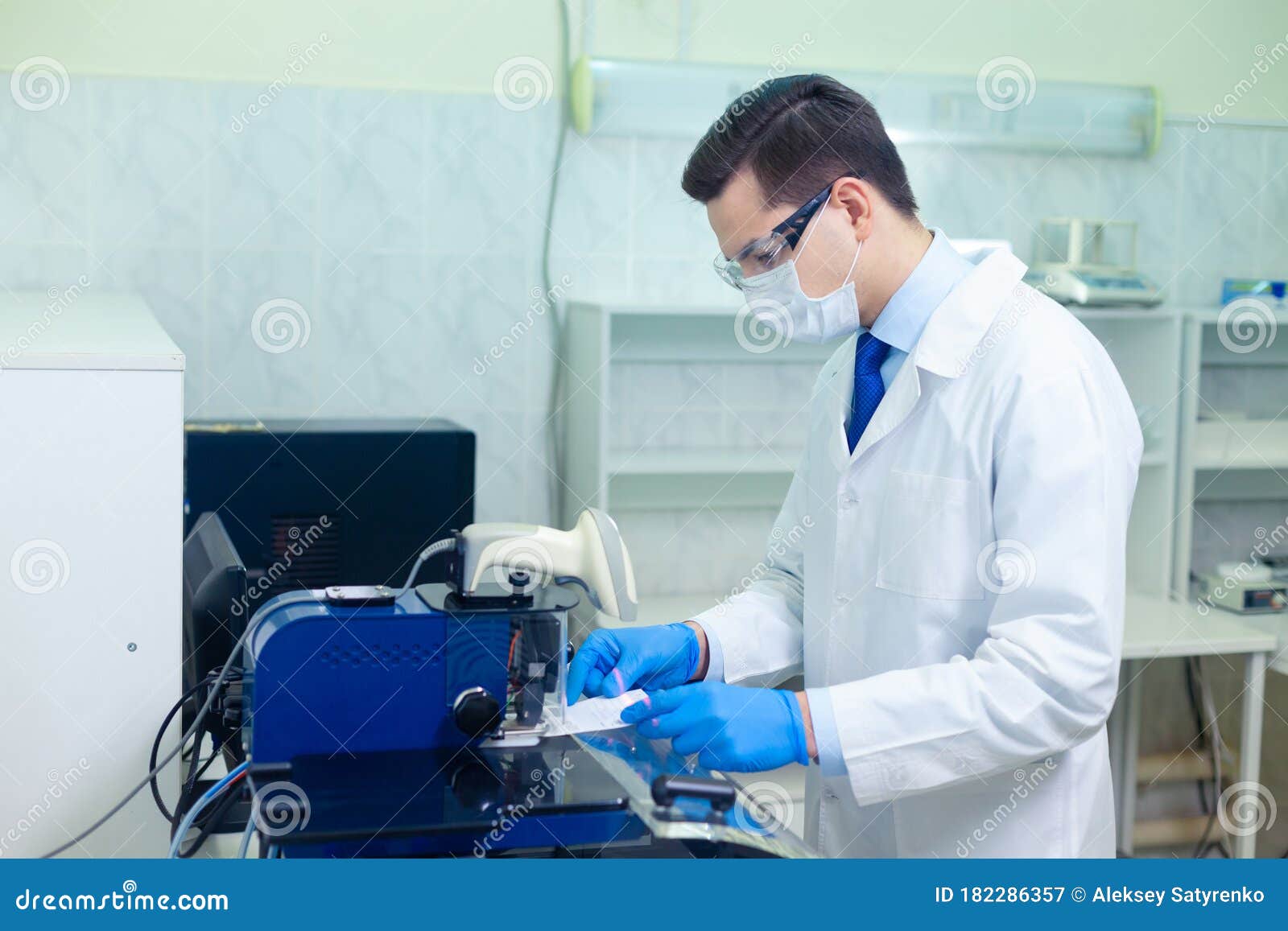 DNA Laboratory. the Expert Puts the Human DNA into the Database Using ...