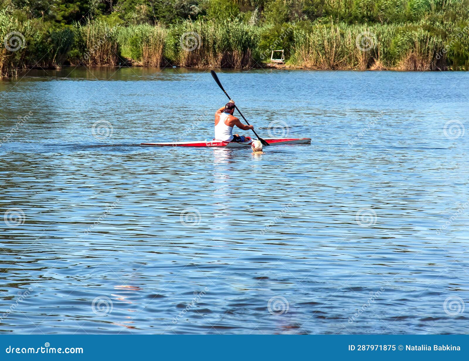Technique of Rowing of a Single Athlete on a Kayak. Paddle Splash ...