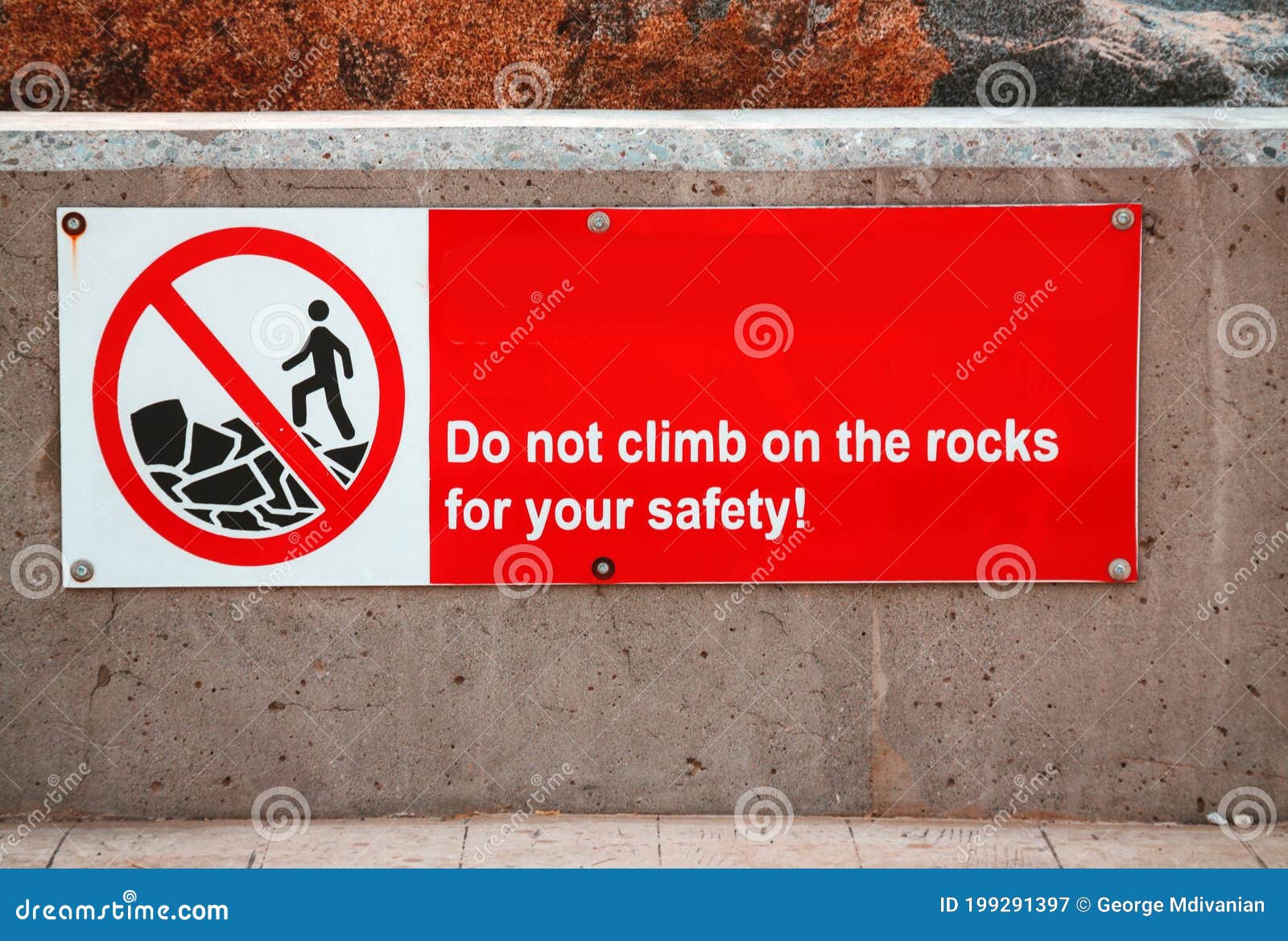 Do not climb on the rocks stock image. Image of fall - 199291397