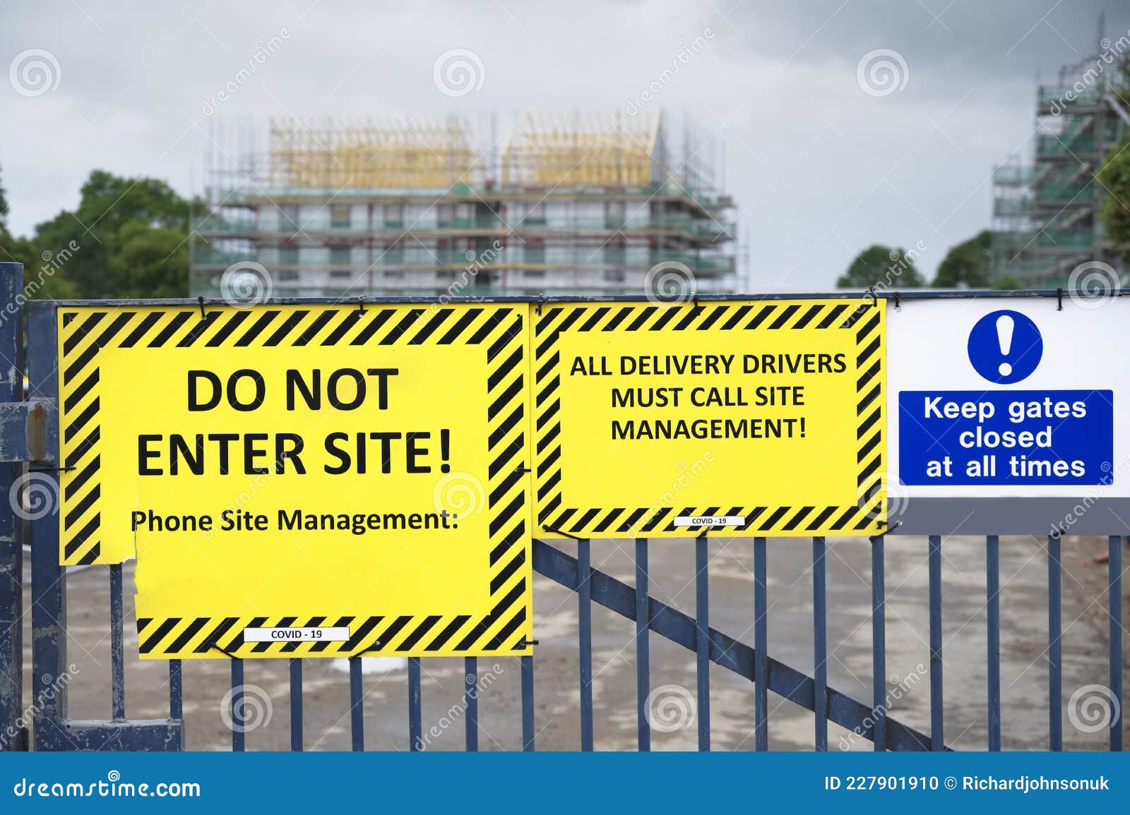 Do Not Enter Construction in Progress Sign on Fence Stock Photo - Image ...