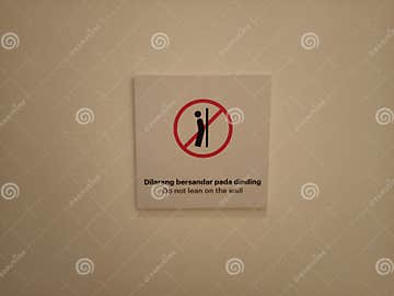 Do Not Lean on the Wall Signage on White Wall Stock Image - Image of ...