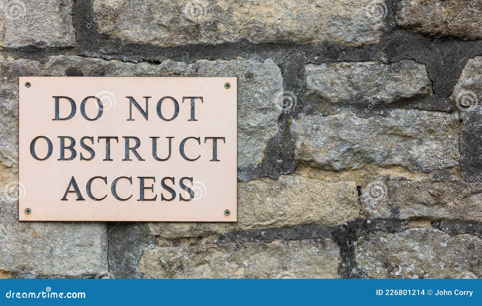 Do Not Obstruct Access Sign on Stone Wall - Background Banner Image ...