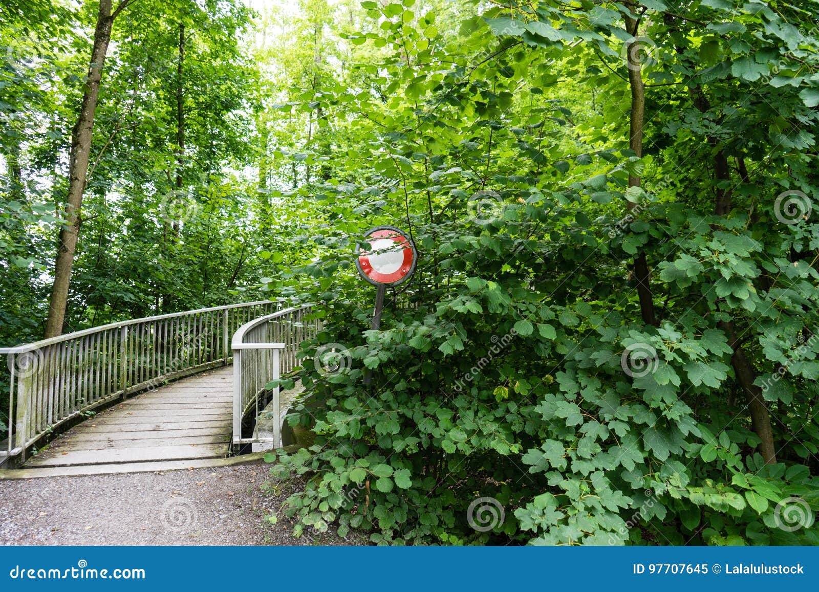 Do Not Pass Stop Sign in Front of a Bridge Overgrown Stock Image ...