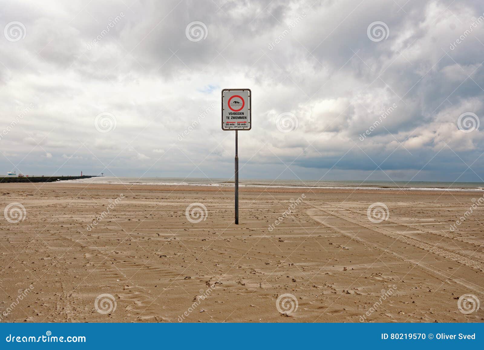 Do Not Swim Sign Board Is On The Sand Beach With A Small Red Flag And ...