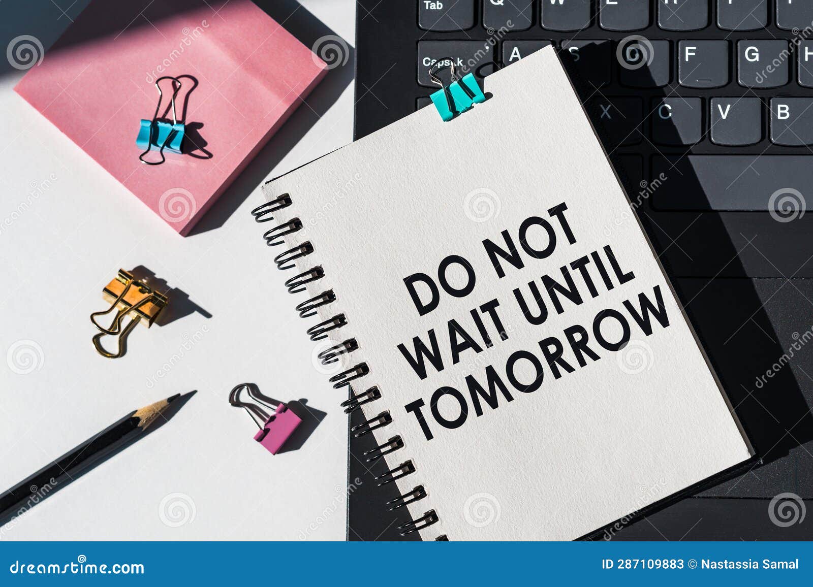 Do Not Wait until Tomorrow Text on Notebook with Keyboard Stock Image ...