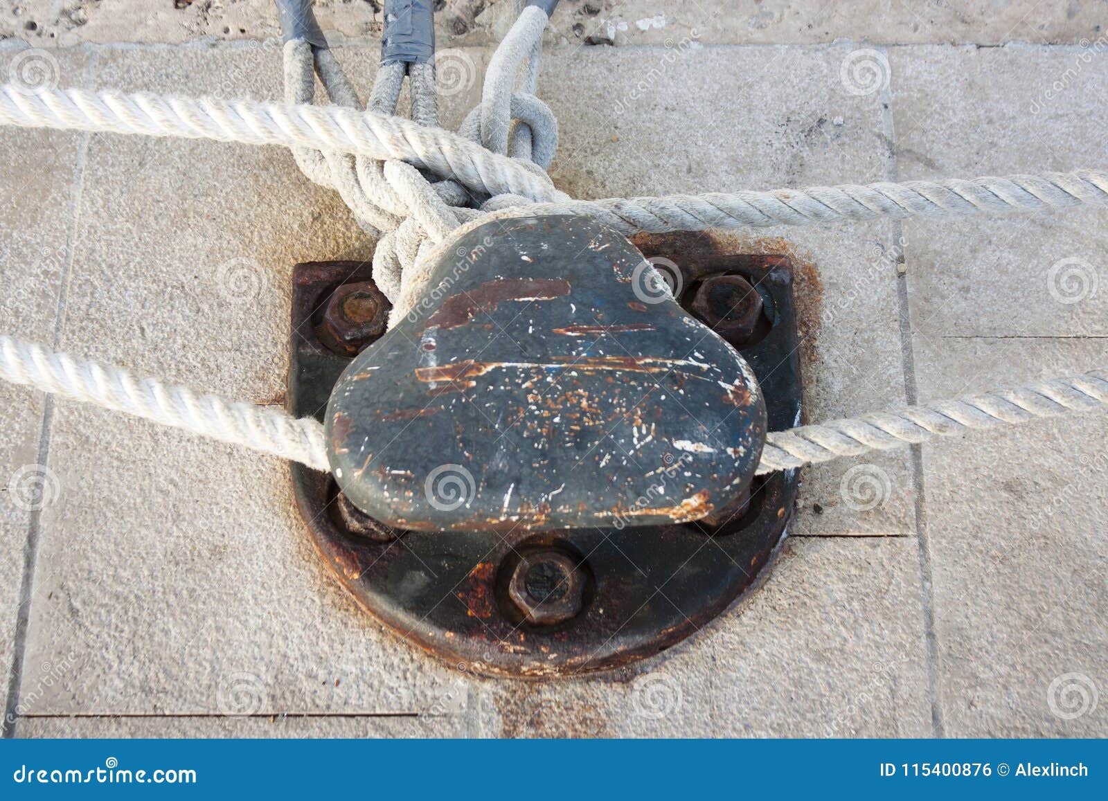 Dock Bollard on Stone Pier with Ship Ropes Stock Photo - Image of ...