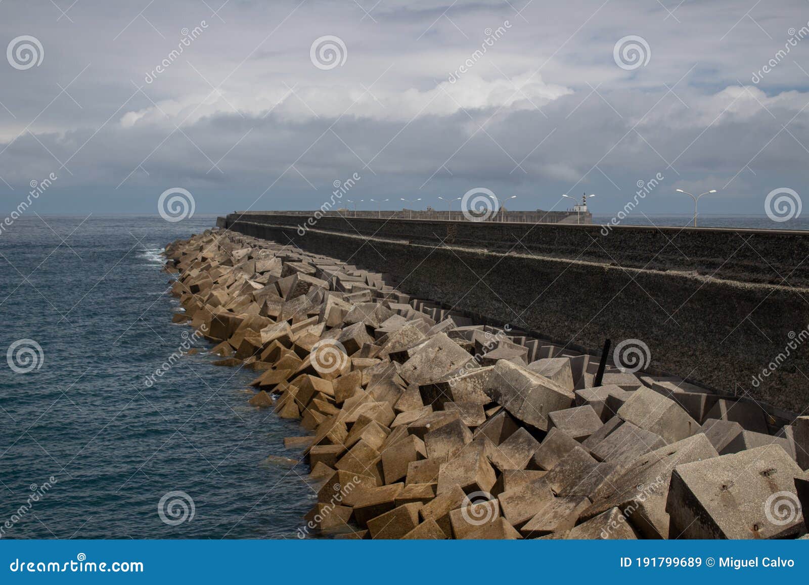 Dock with Cube Shaped Rocks Stock Image - Image of mediterranean, port ...
