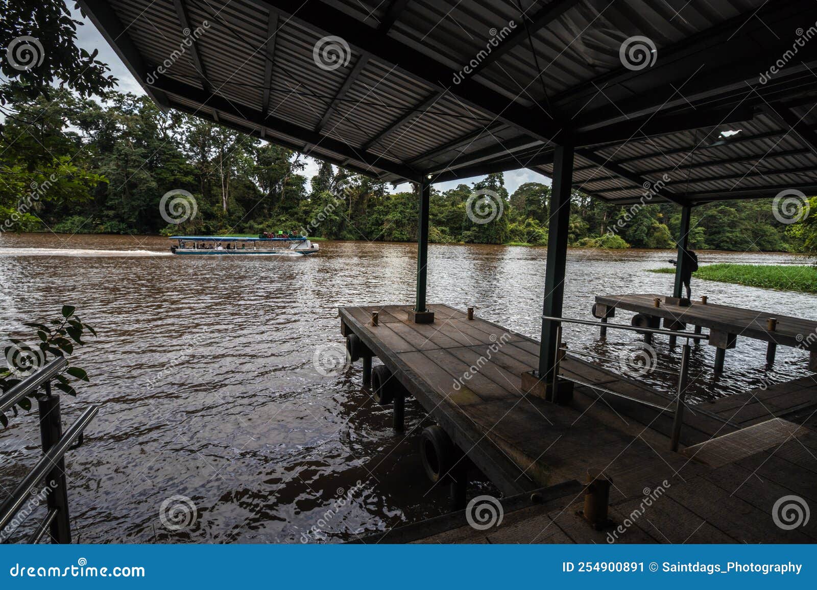 Dock on the Riverbank with Boats and Surrounded by Nature Stock Image ...
