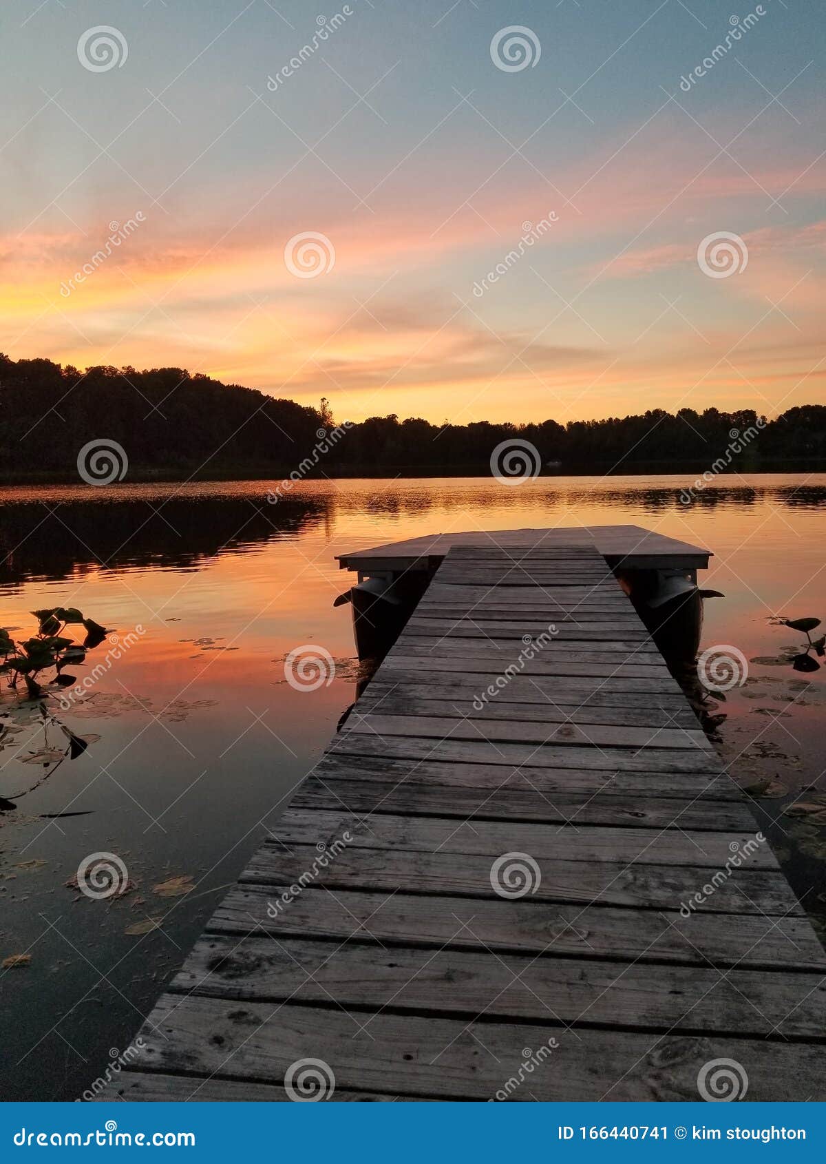 Dock at sunset stock image. Image of sunset, water, dock - 166440741