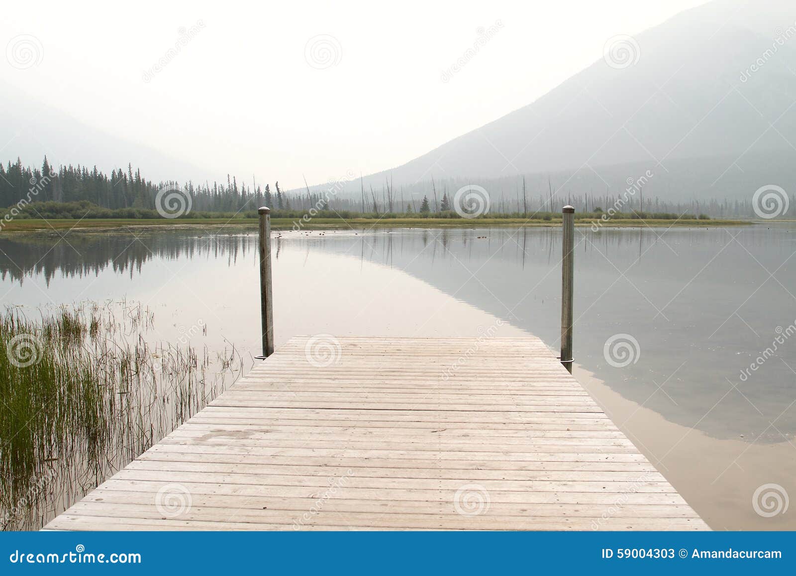 A dock on the water stock image. Image of mountain, background - 59004303