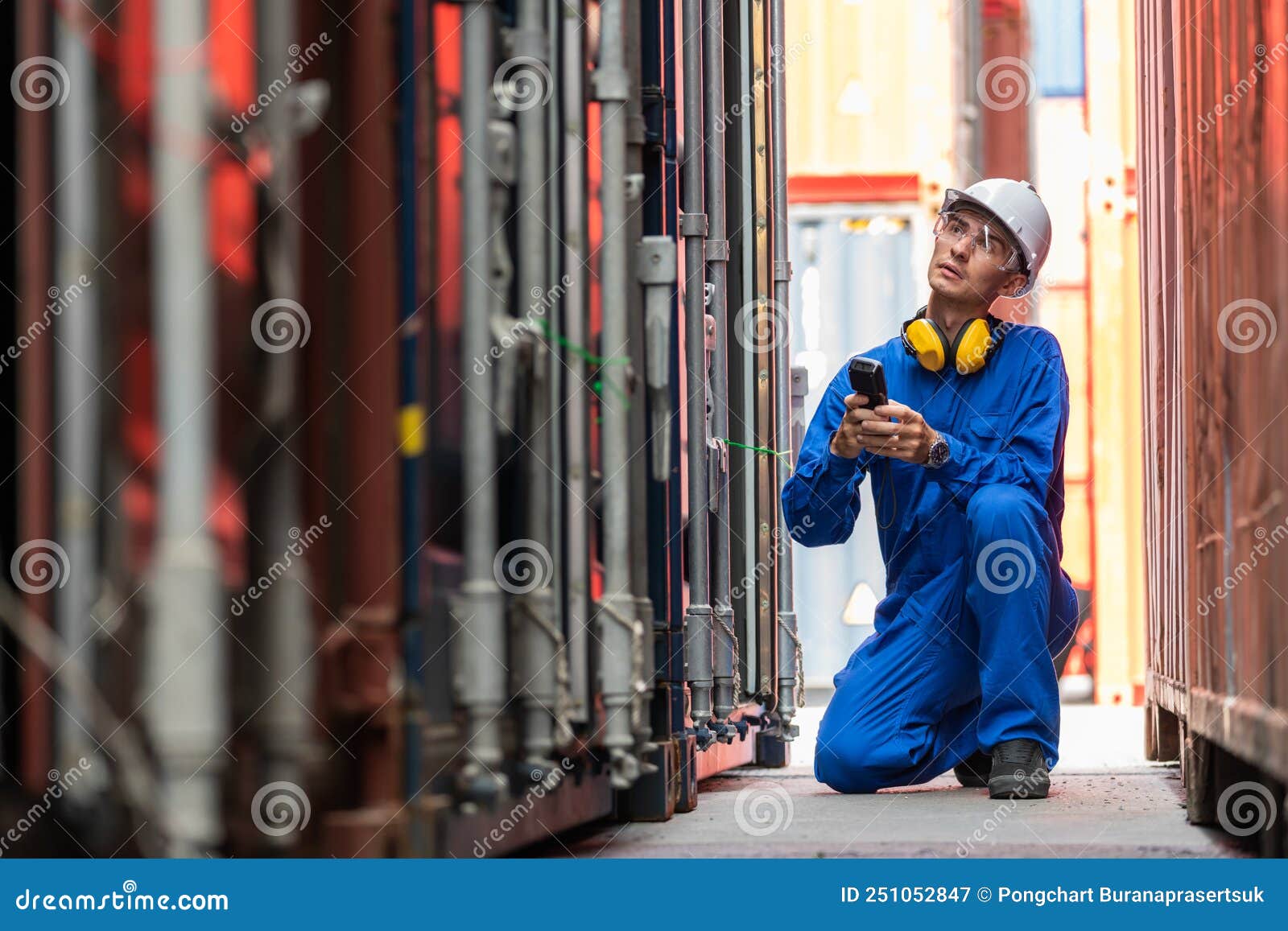Dock Worker Man in Safety Vest Holding Barcode Scanner and Looking at ...
