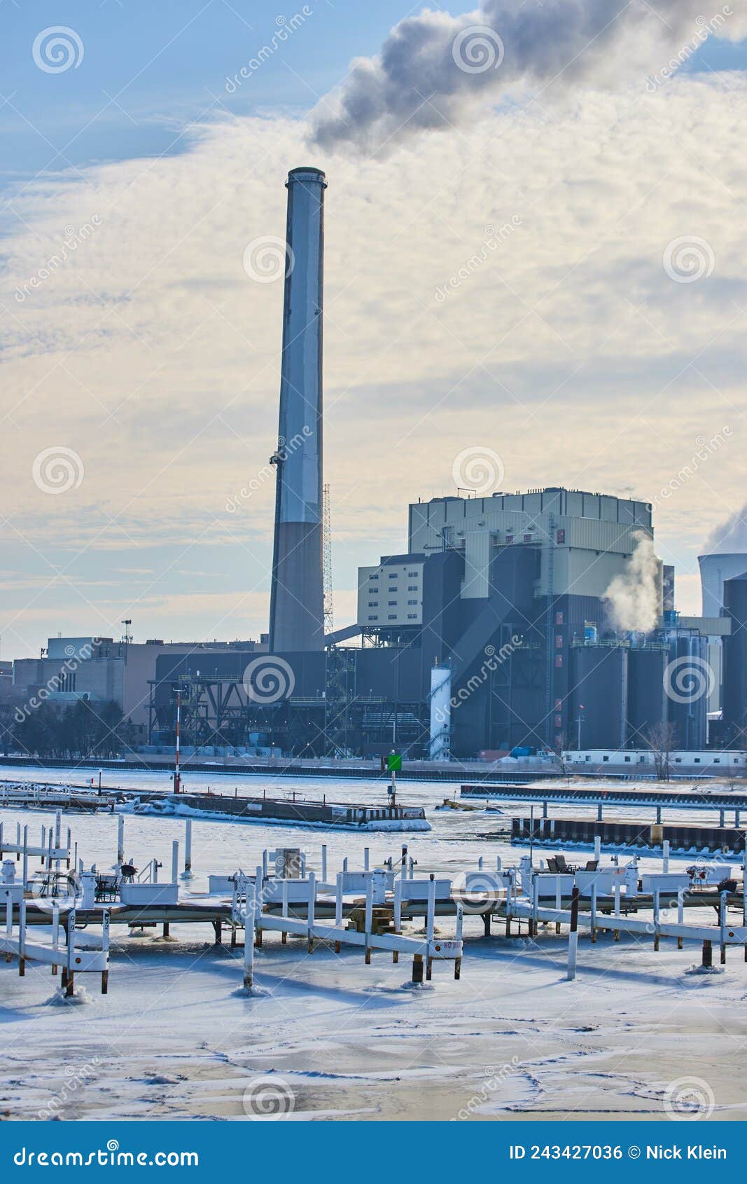 Docks on Lake with Large Factory in Background Stock Photo - Image of ...