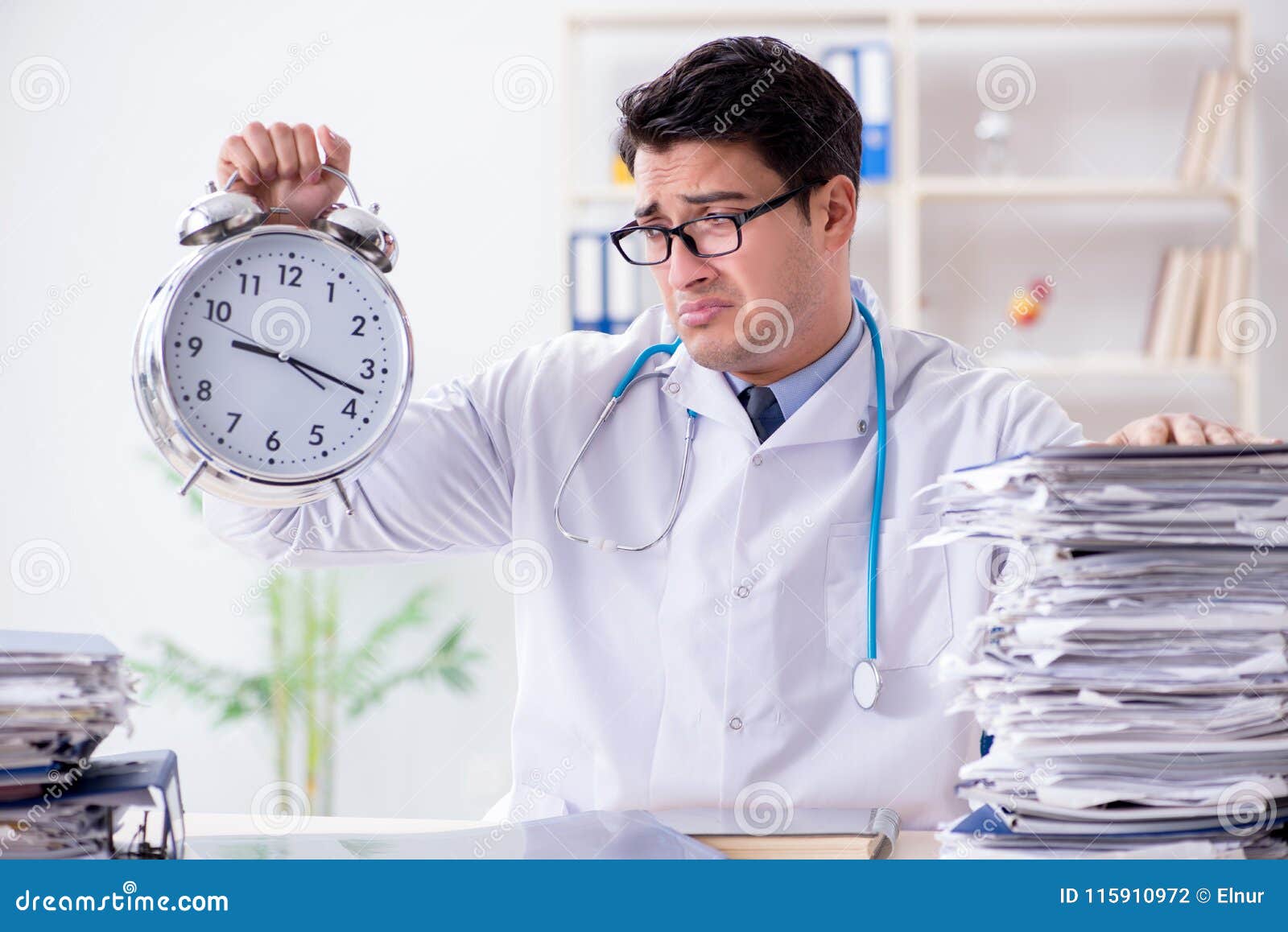 The Doctor with Alarm Clock in Urgent Check-up Concept Stock Photo ...