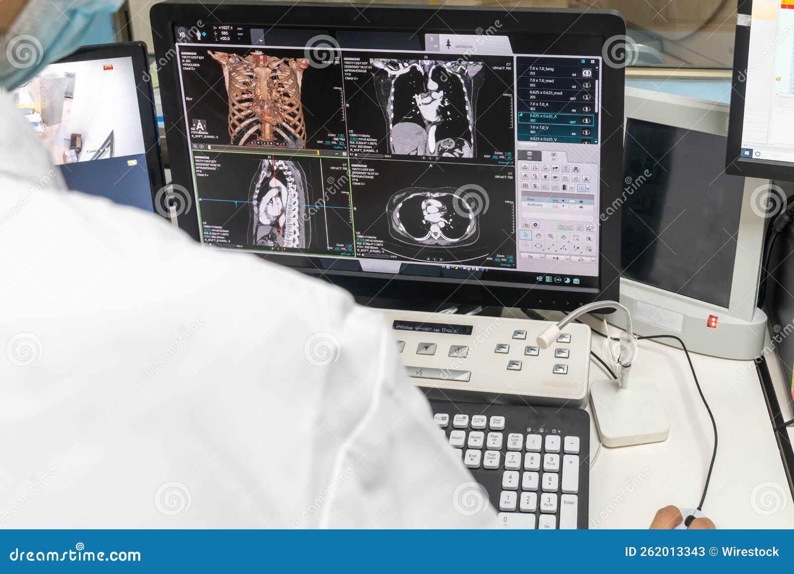 Doctor Analyzing the Test Results from MRI Scanner on the Computer ...