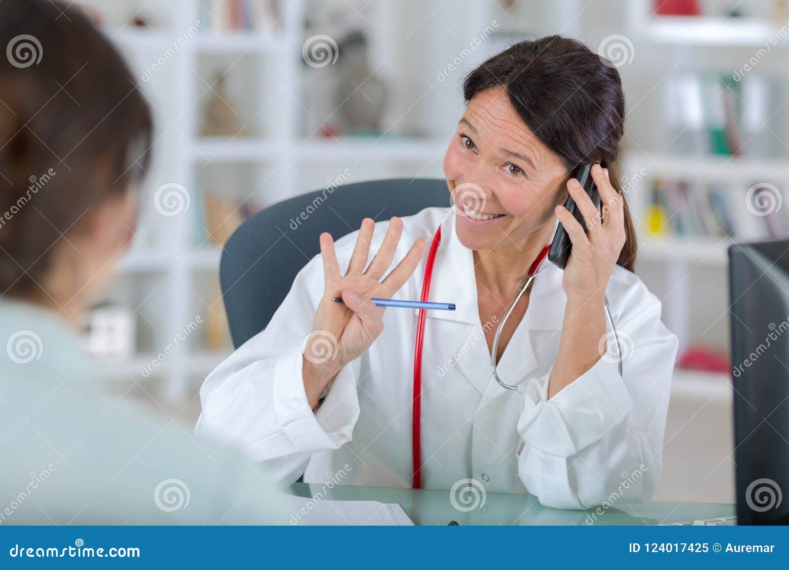 Doctor answering a call stock image. Image of healthcare - 124017425