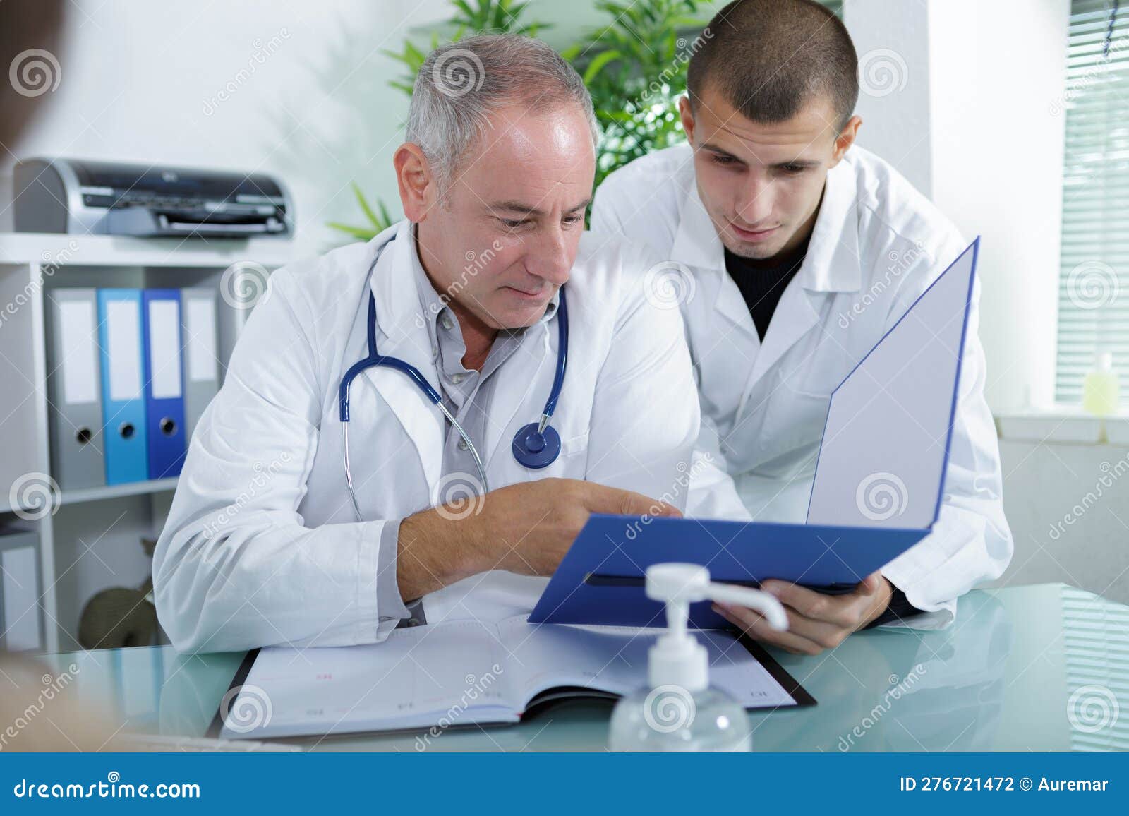 Doctor and Assistant Working Together at Hospital Stock Photo - Image ...