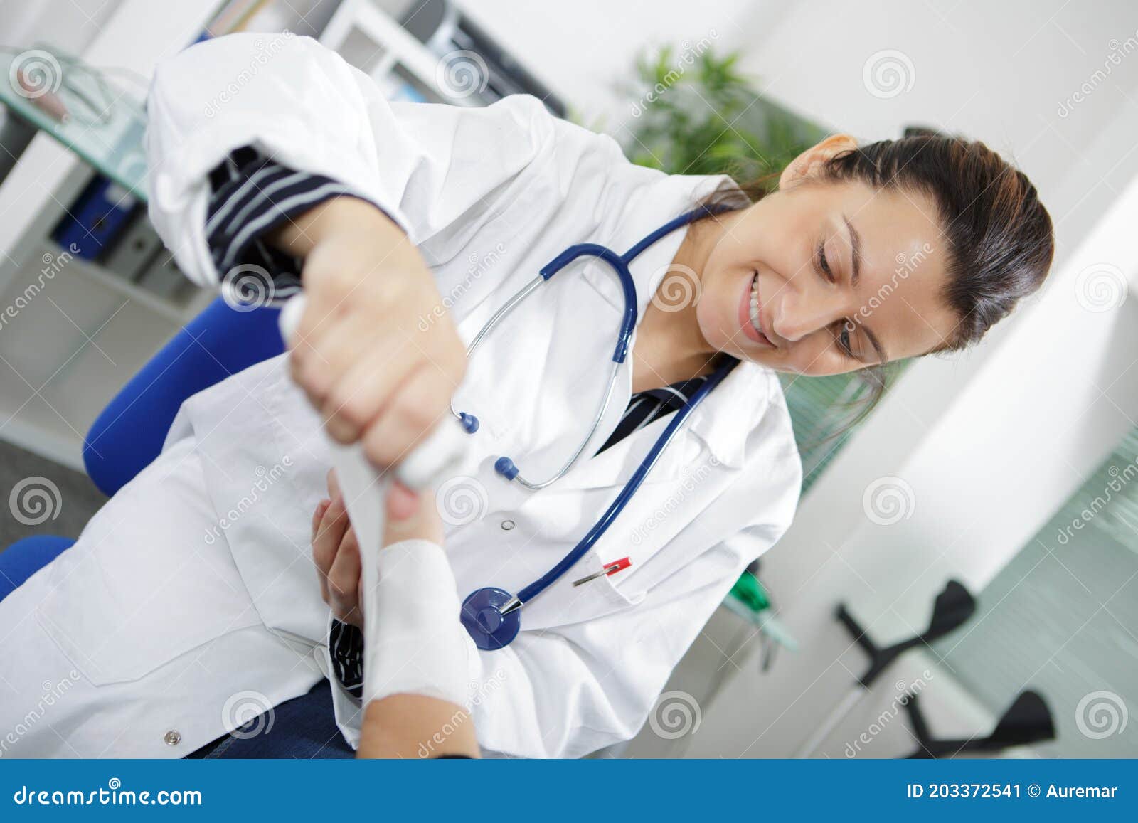 Doctor Bandaging Upper Limb Patient Stock Image - Image of injured ...