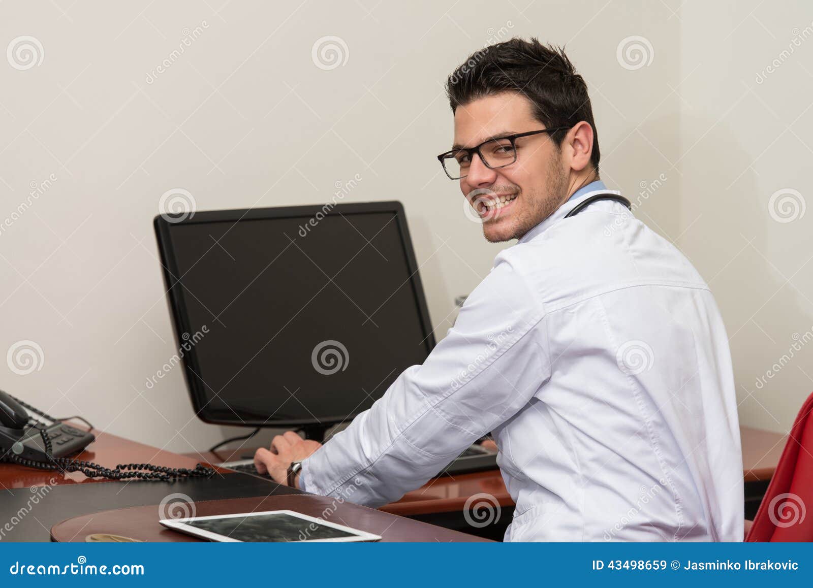 Doctor on a Break with His Computer Stock Image - Image of clinic ...