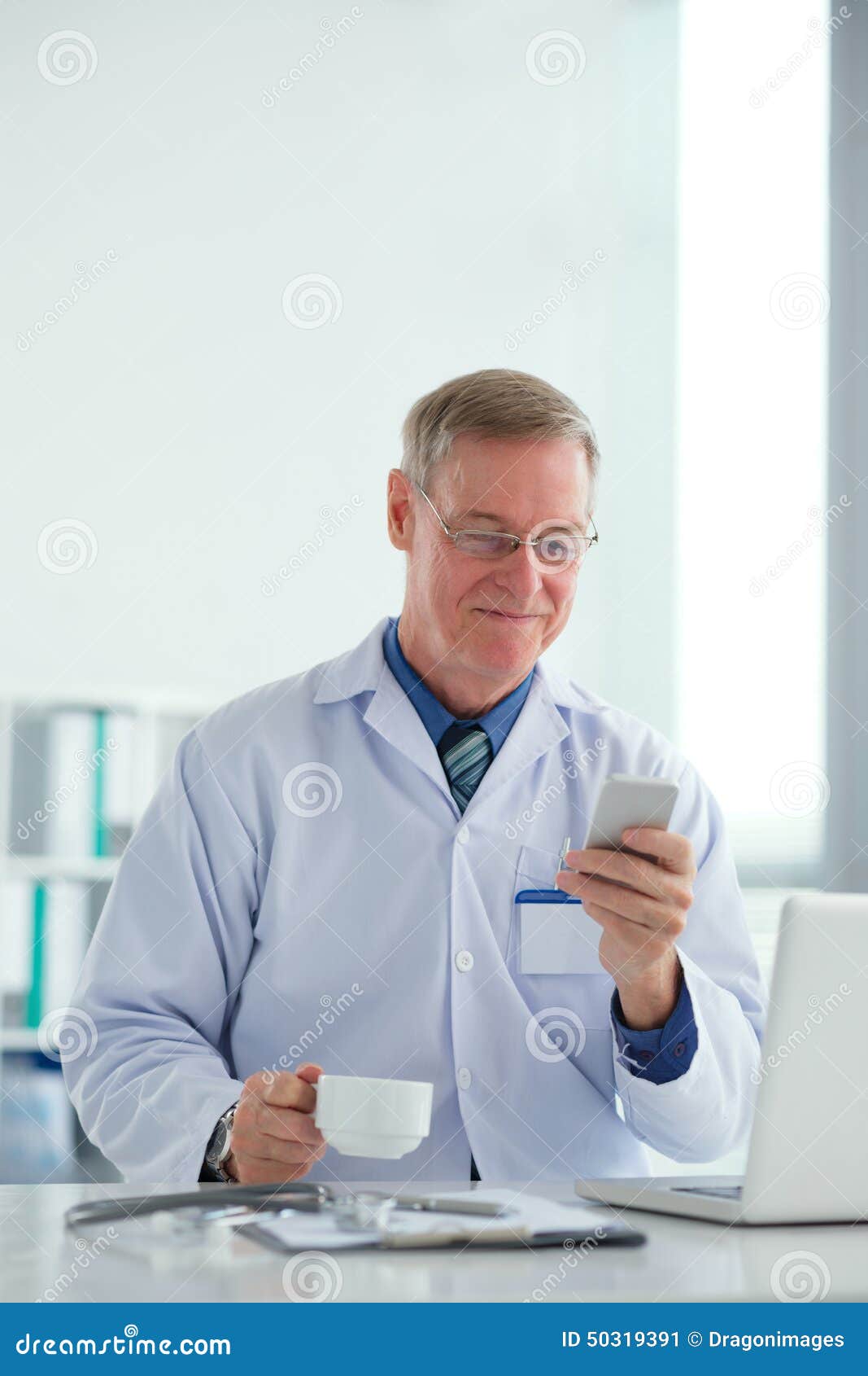 Doctor at break stock image. Image of smiling, messaging - 50319391