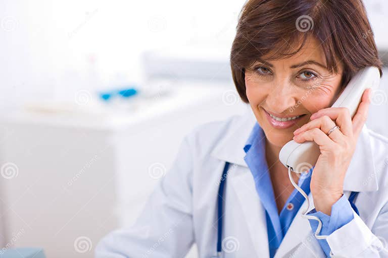 Doctor calling on phone stock image. Image of exam, calling - 7228893