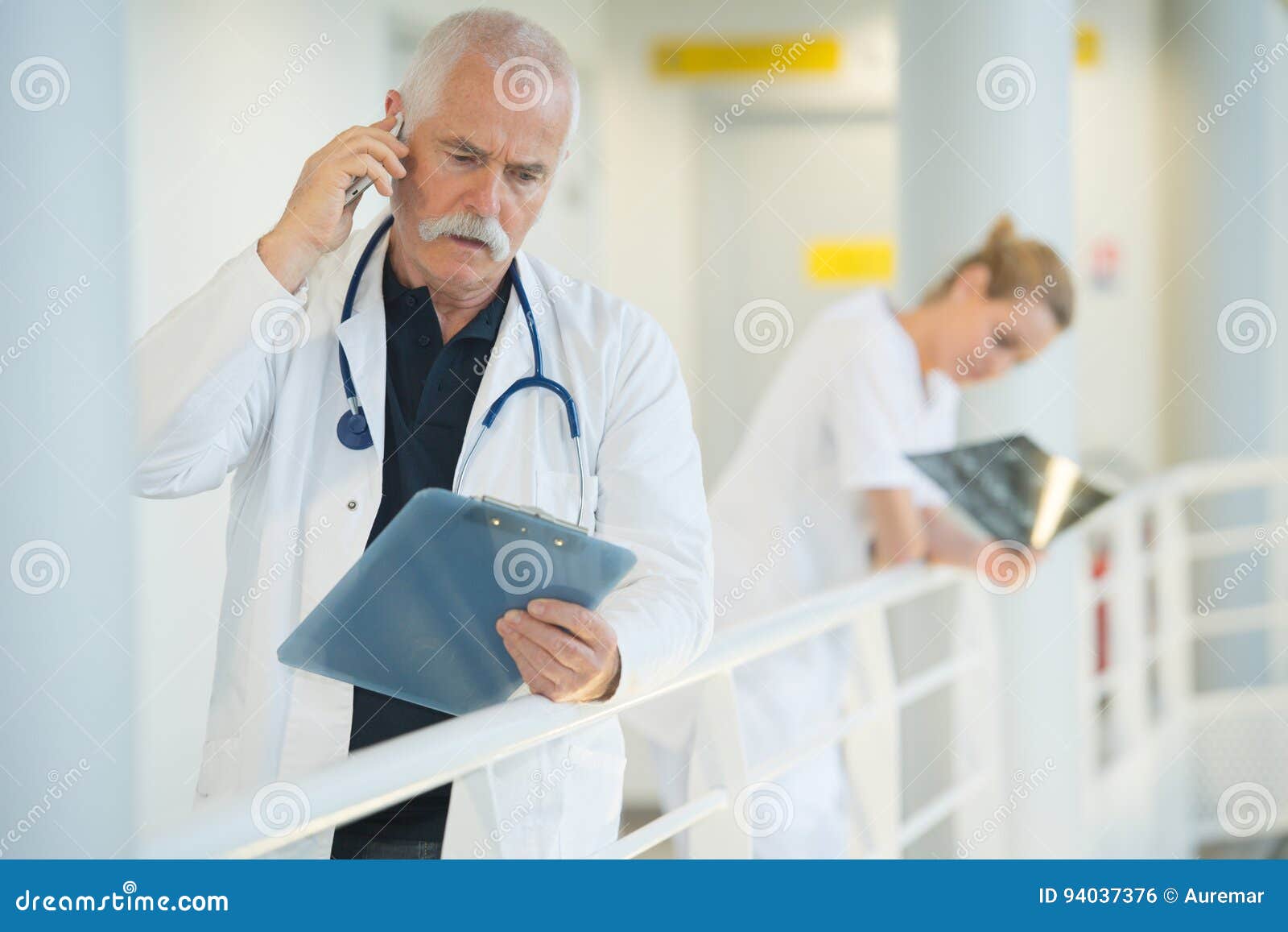 Doctor calling on phone stock photo. Image of treatment - 94037376