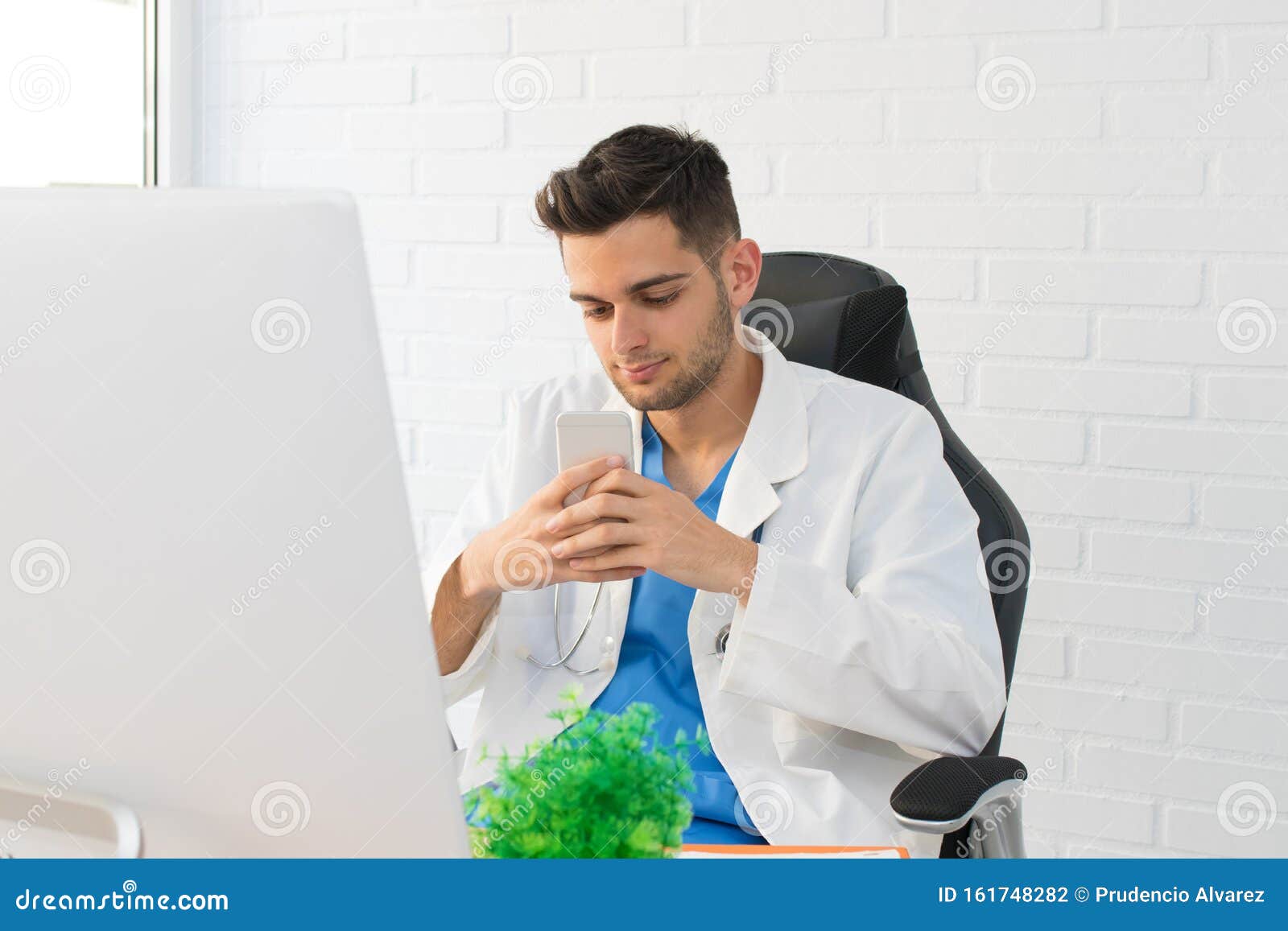 Doctor with the Cell Phone at the Desk Stock Photo - Image of digital ...